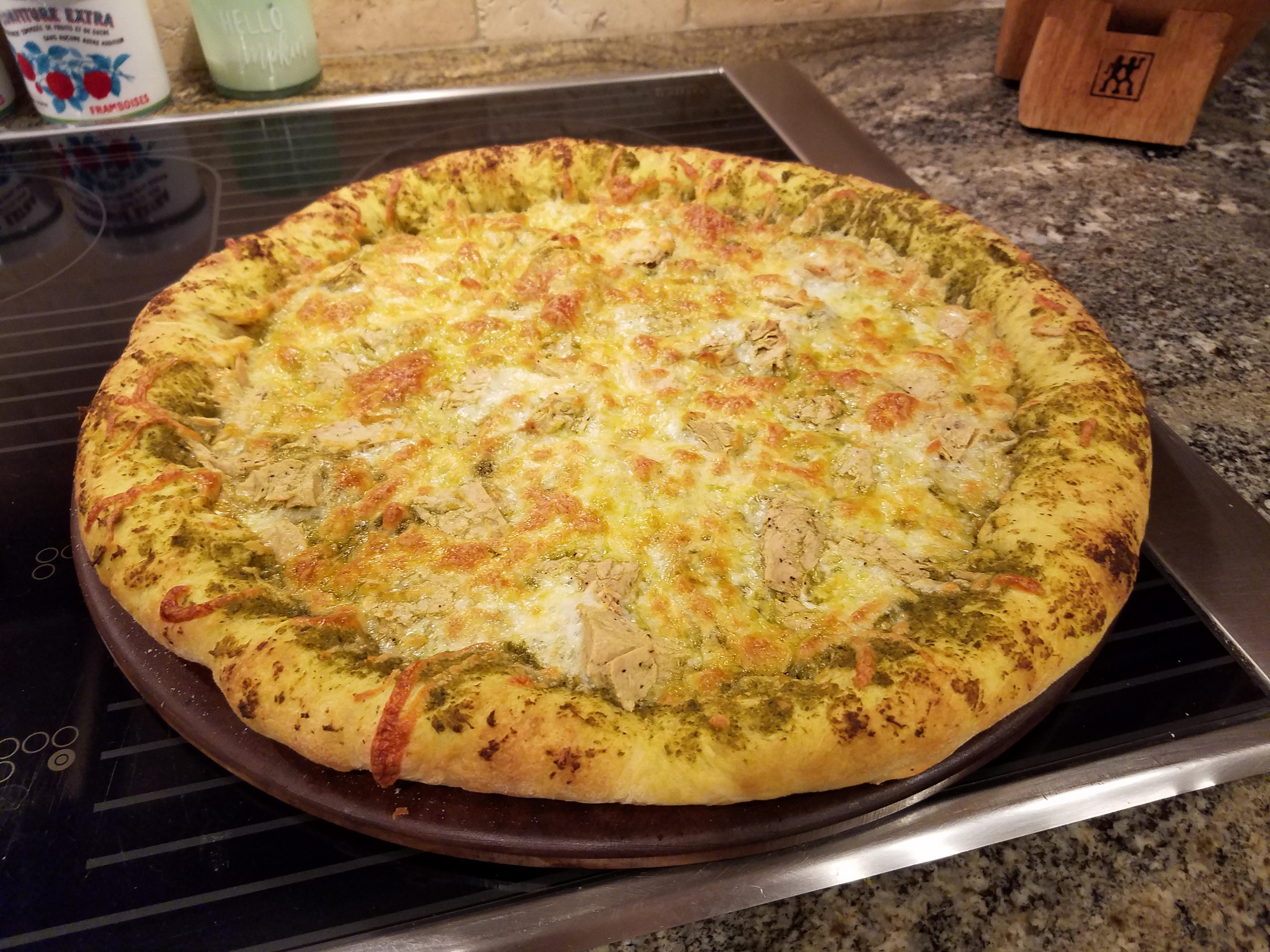 Colby jack stuffed crust with pesto, faux chik'n, mozzarella pizza made with pizza stone | Scrolller