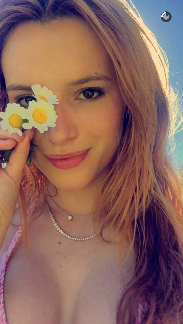 Cute with flowers and cleavage | Scrolller