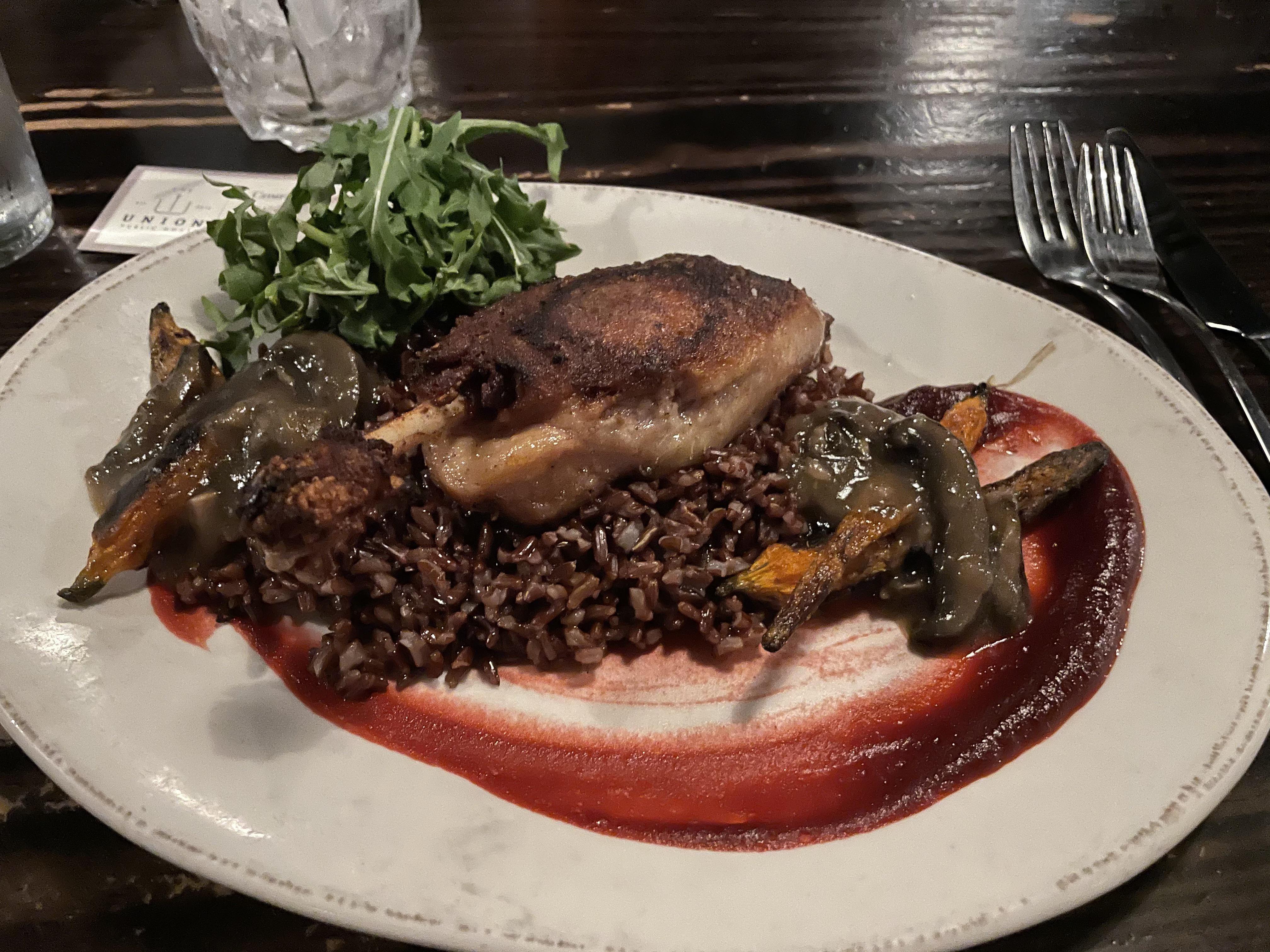 Duck with scarlet rice and mushrooms confit. | Scrolller
