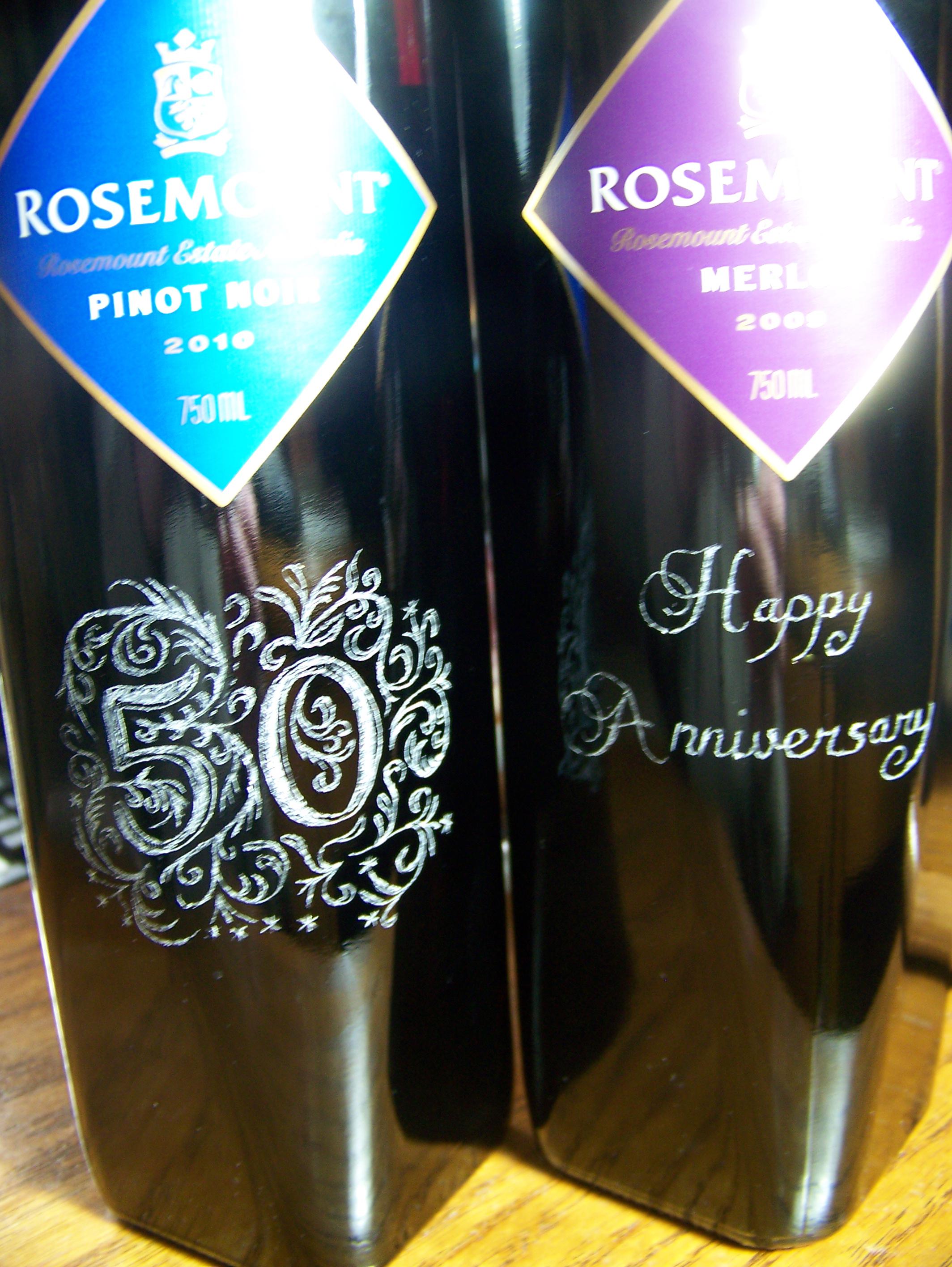 Engraving on wine bottles for a 50th anniversary | Scrolller