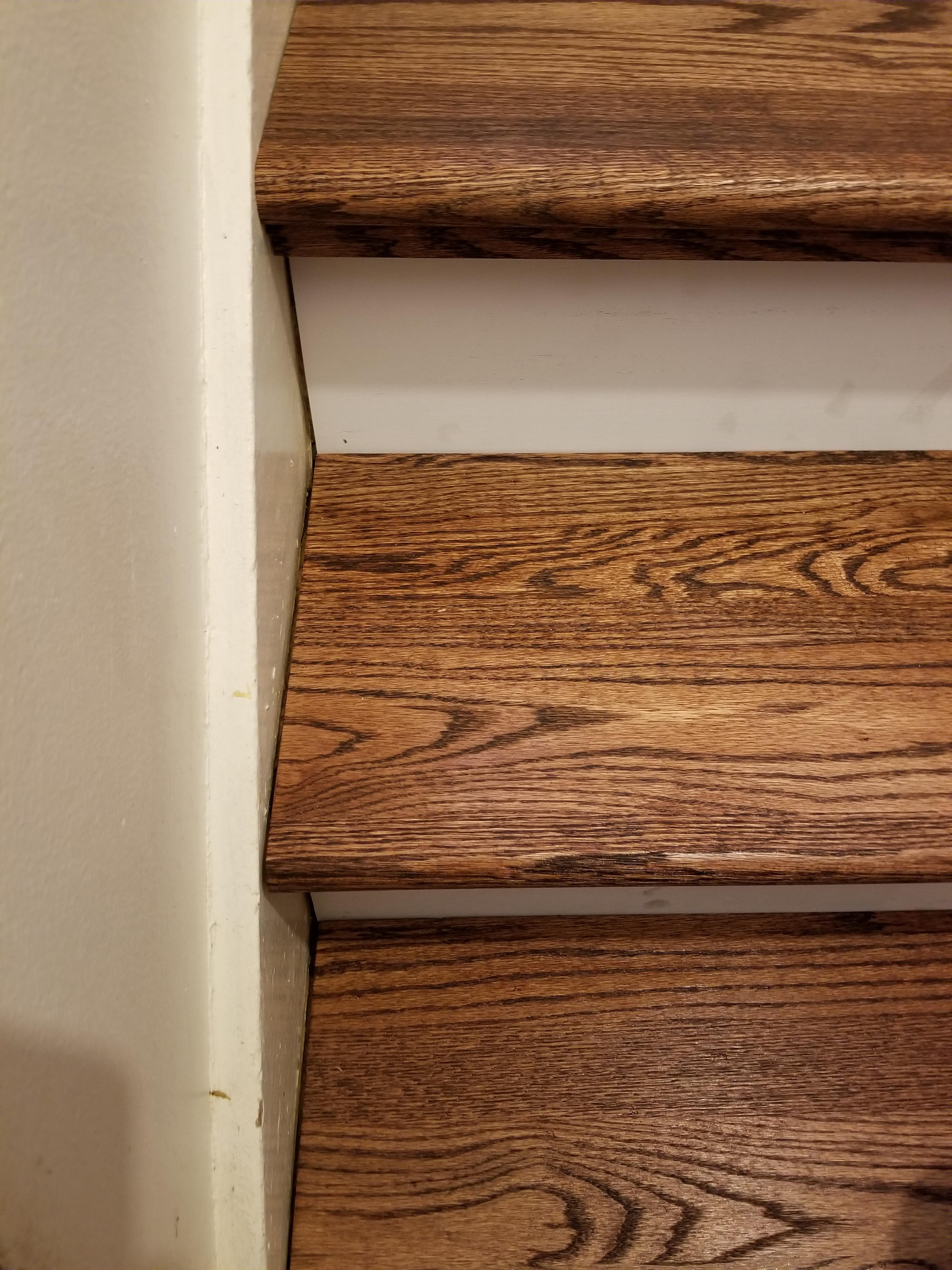 Filling the gap between the trim and stair. | Scrolller