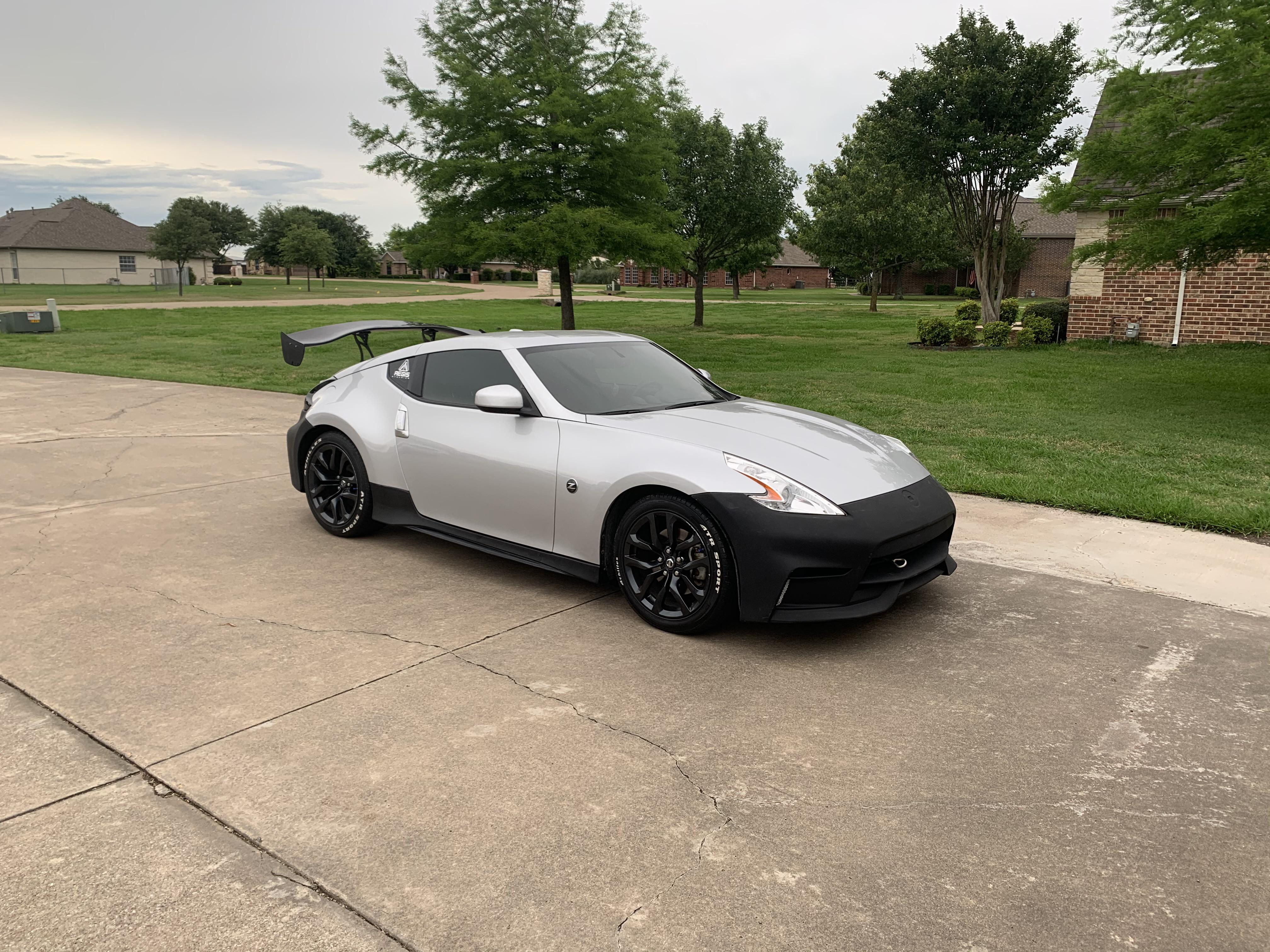 Finally finished installing the body kit and spoiler. Next few months will be working on the ...