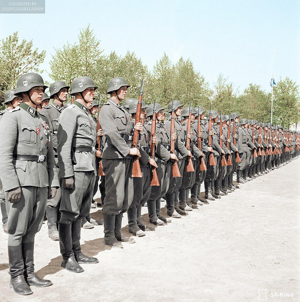 Finnish Waffen-SS volunteers, during their homecoming parade in Hanko, Finland. June 1, 1943 ...