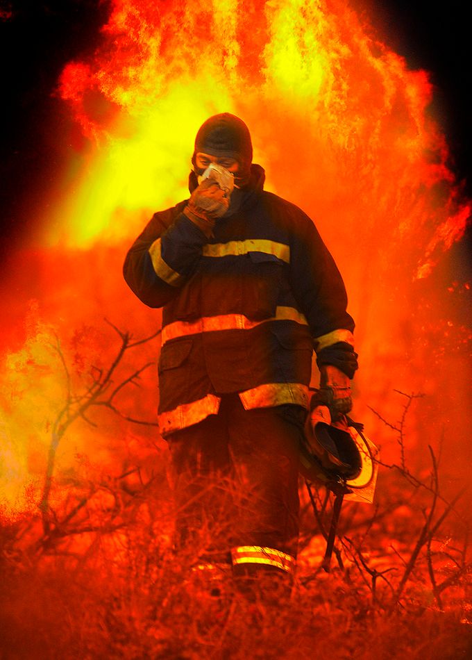 Firefighter walking out of a forest fire [680x950] | Scrolller
