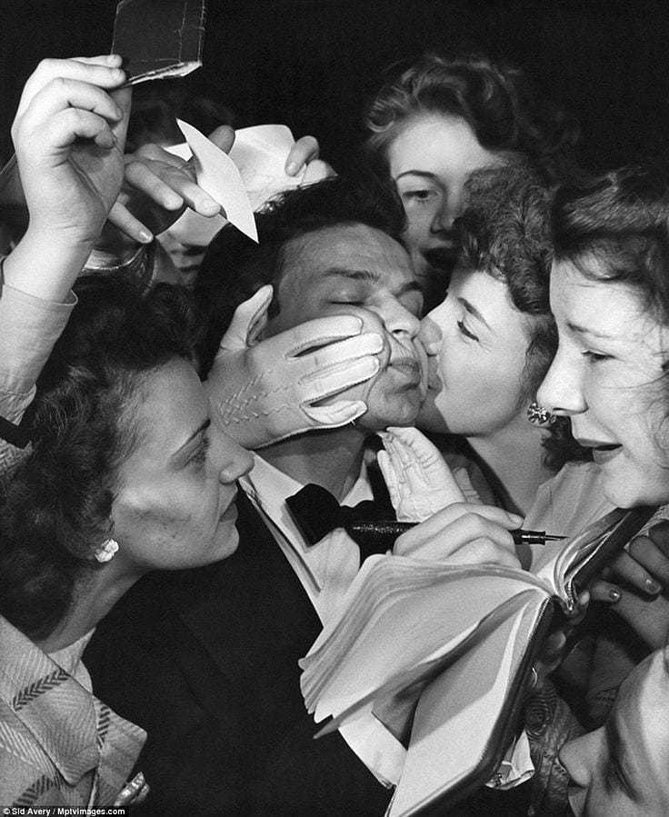 Frank Sinatra is greeted by fans in 1943 | Scrolller