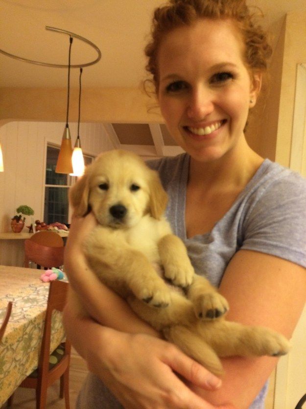 Girl cuddling a cute puppy with braces | Scrolller