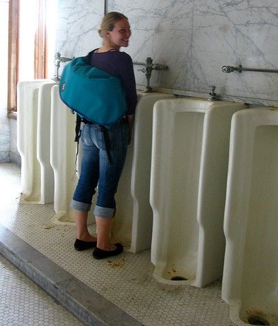 Girl in front of urinal | Scrolller