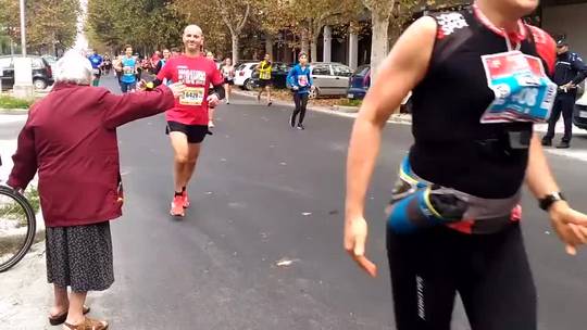 Grandma gives high-fives at marathon | Scrolller