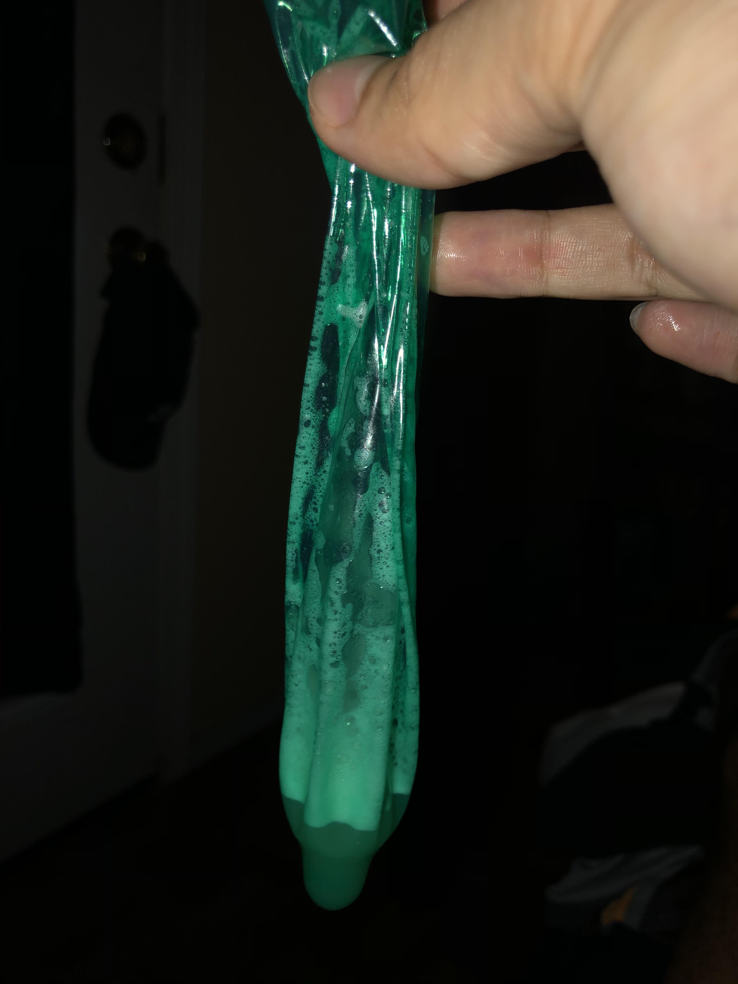 Green loaded condom filled with Mexican man gravy. | Scrolller