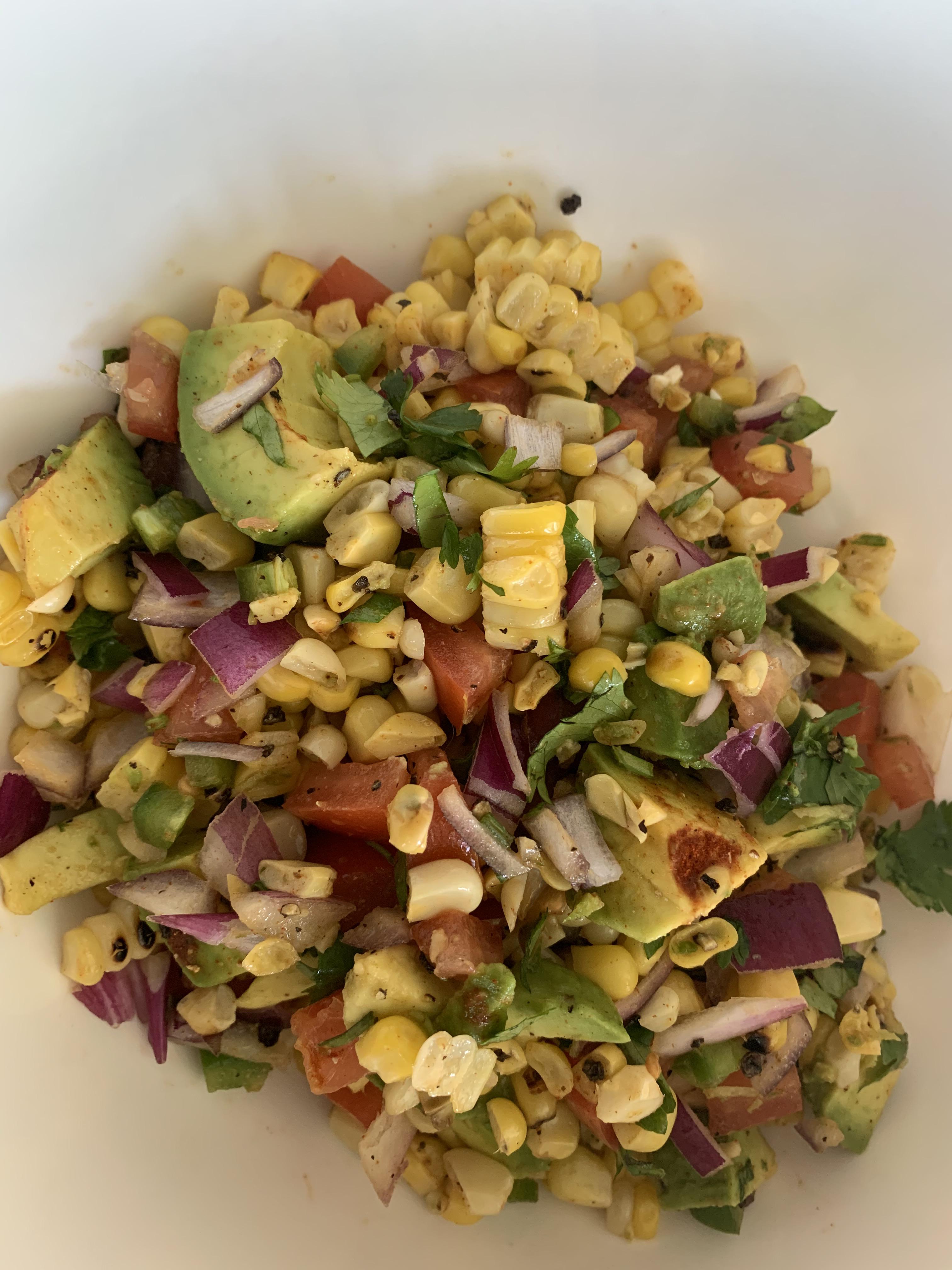 Grilled fresh corn, avocado, tomato, cilantro and red onion salad | Scrolller
