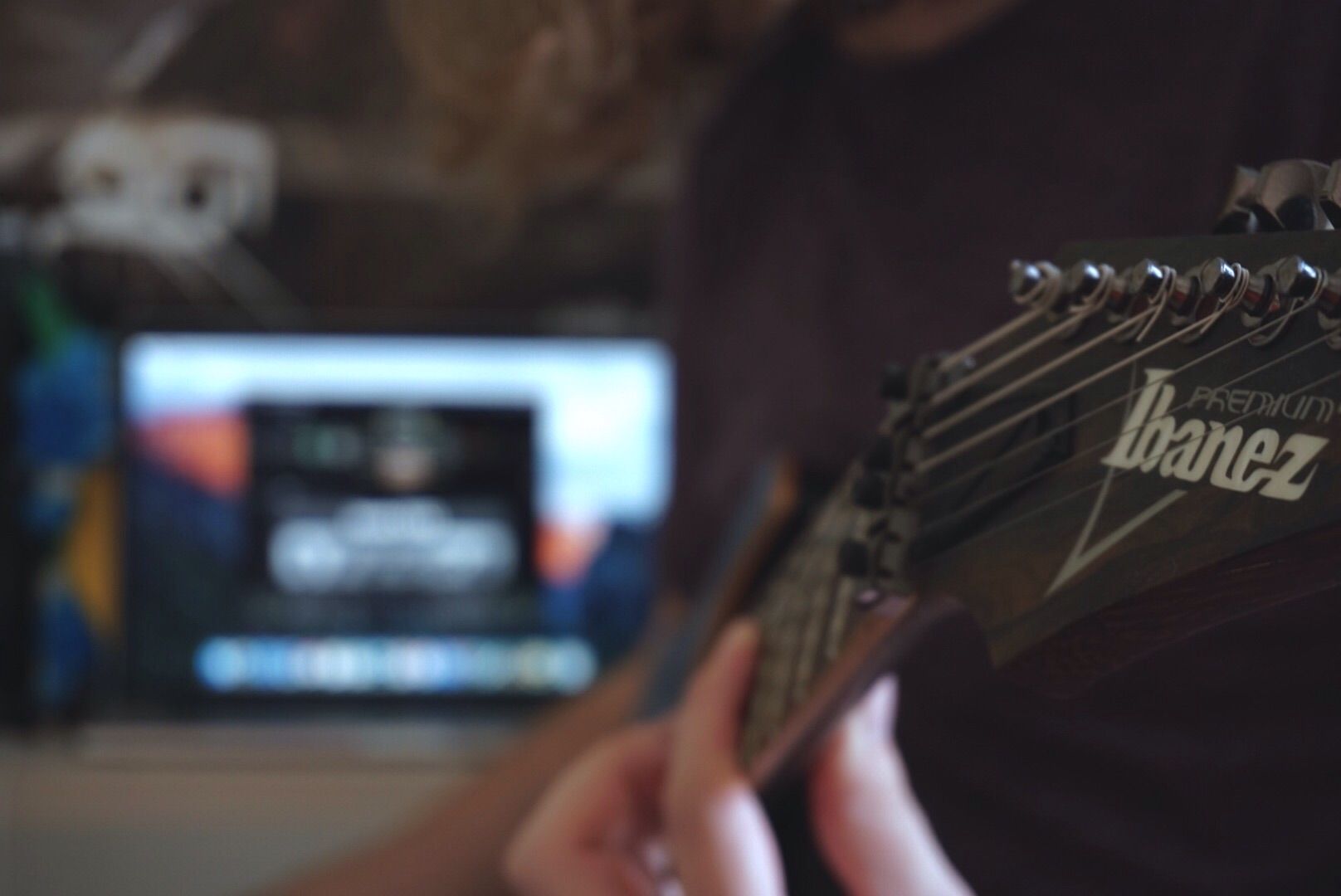 Guitar Playing Bokeh | Scrolller
