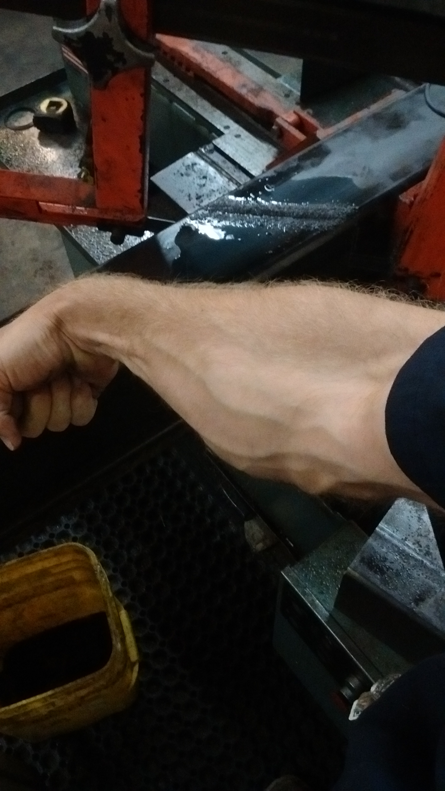 Hard not to look weird while taking photos of my forearm in the machine shop. | Scrolller