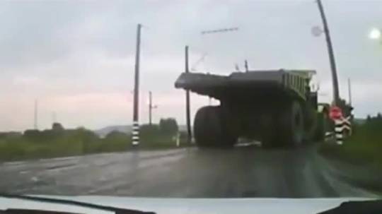 Shockwave across the field as a dump truck tire explodes | Scrolller