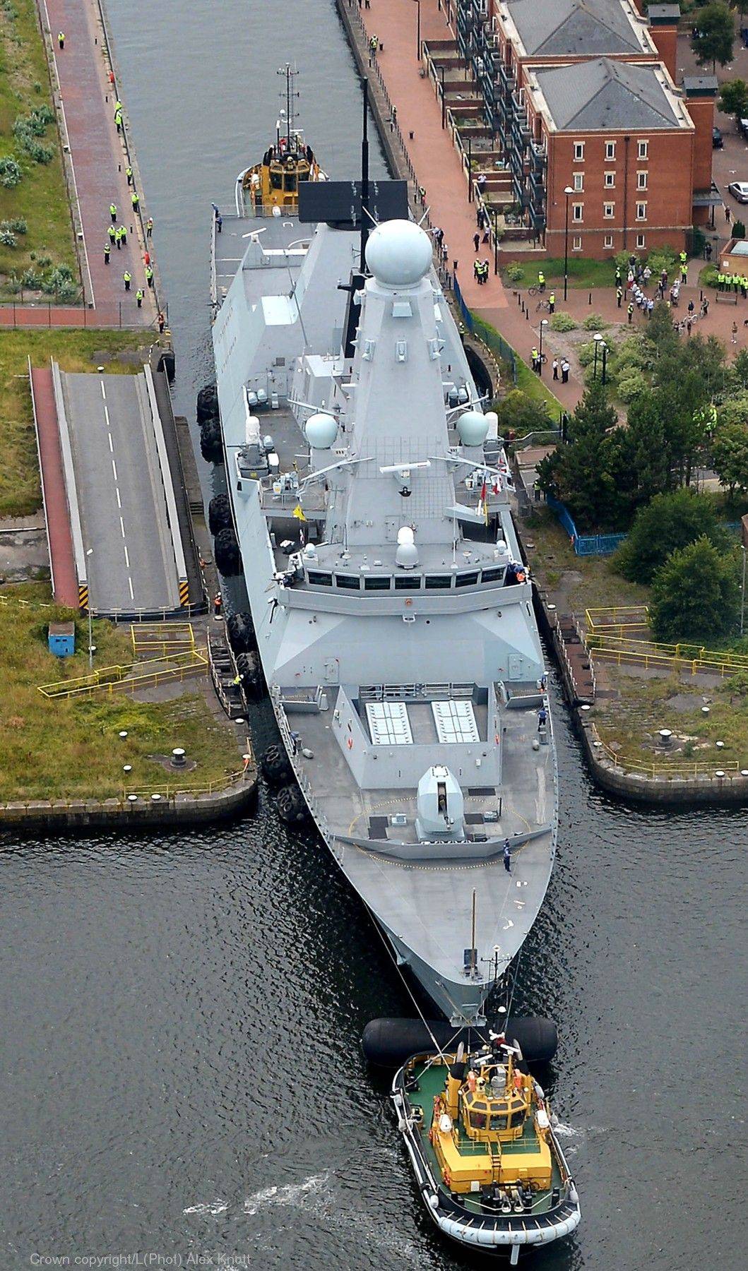 HMS Duncan squeezing bthrough a canal. | Scrolller