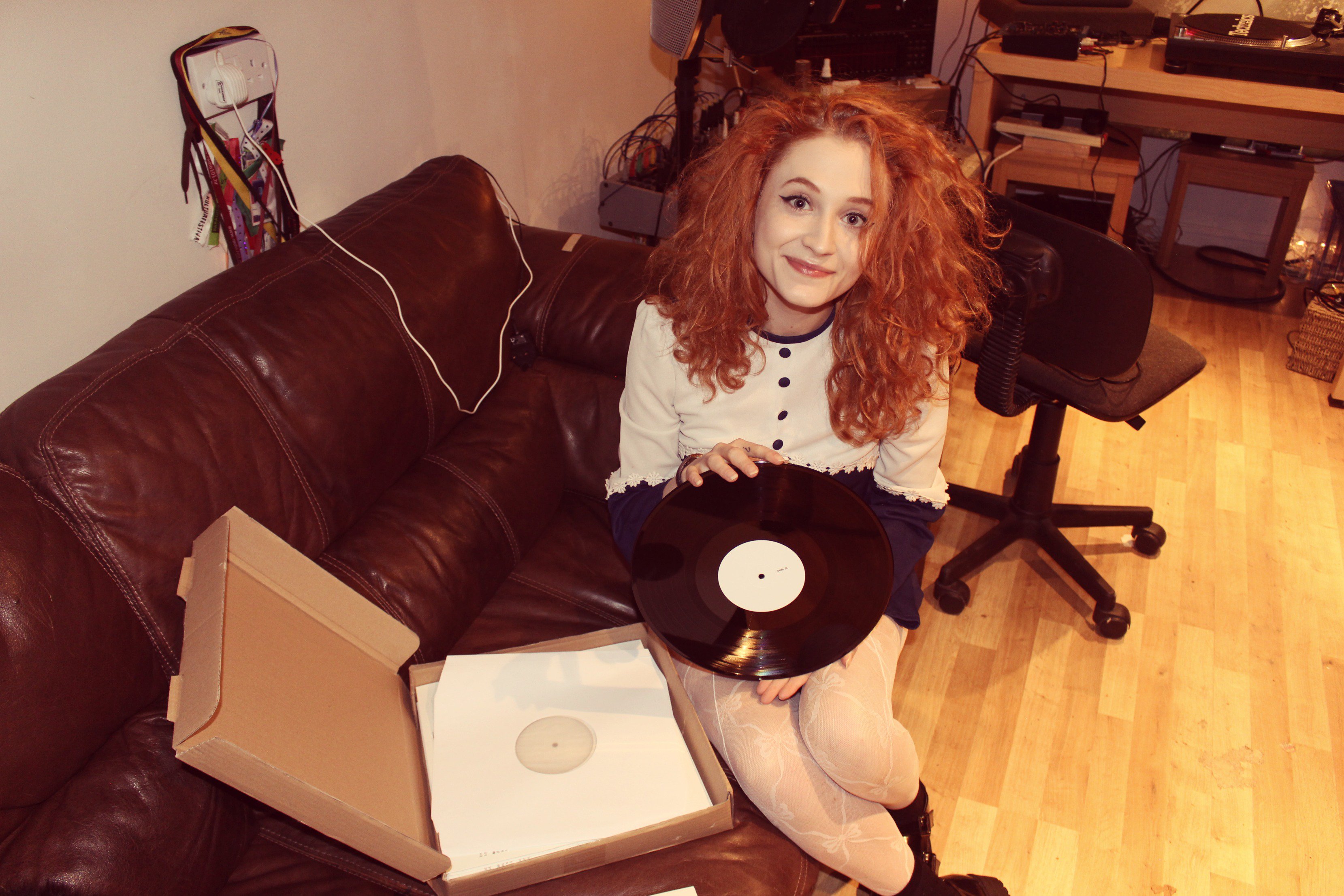 Holding her first vinyl | Scrolller