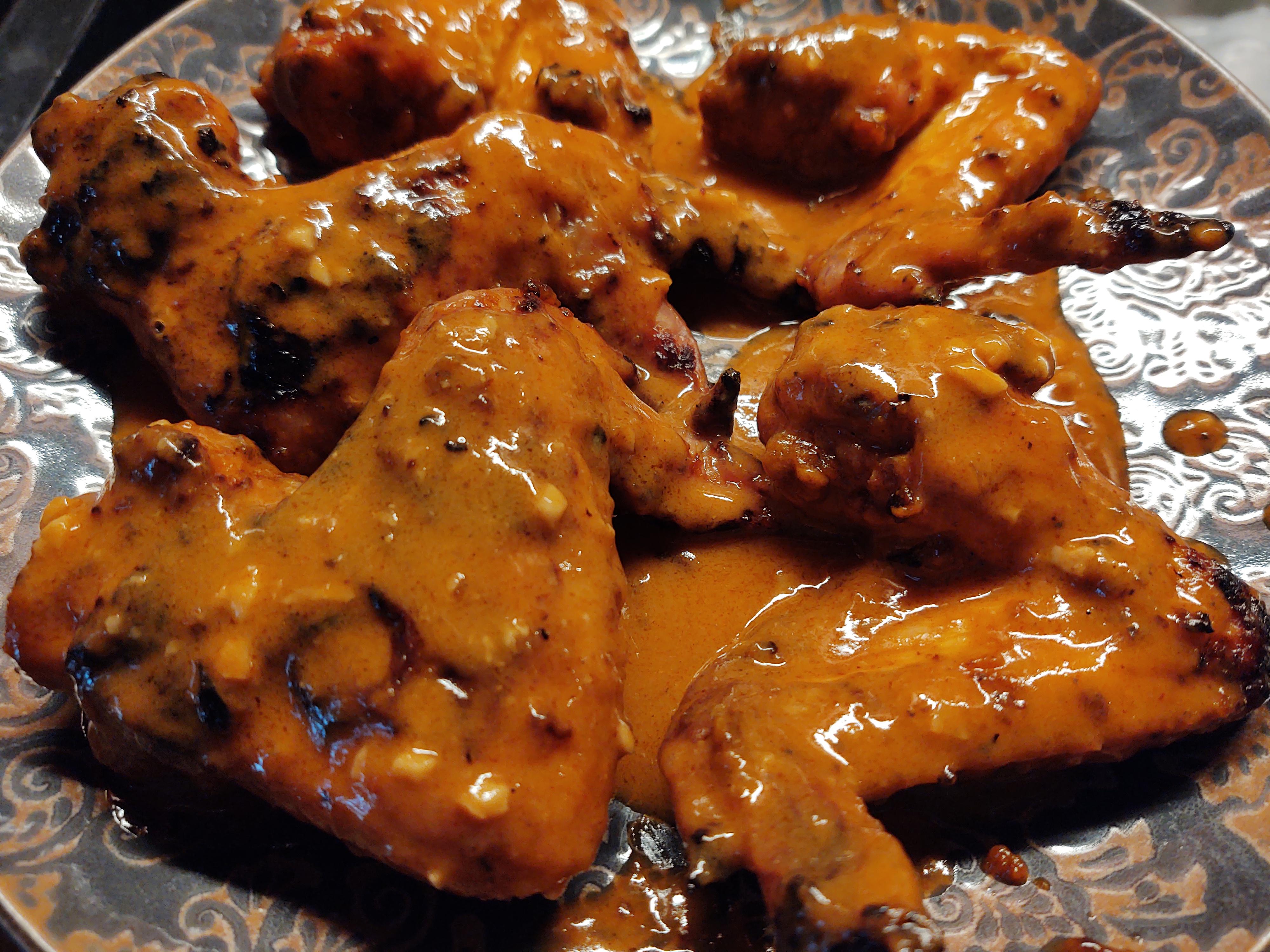 Homemade grilled wings with homemade spicy garlic sauce | Scrolller