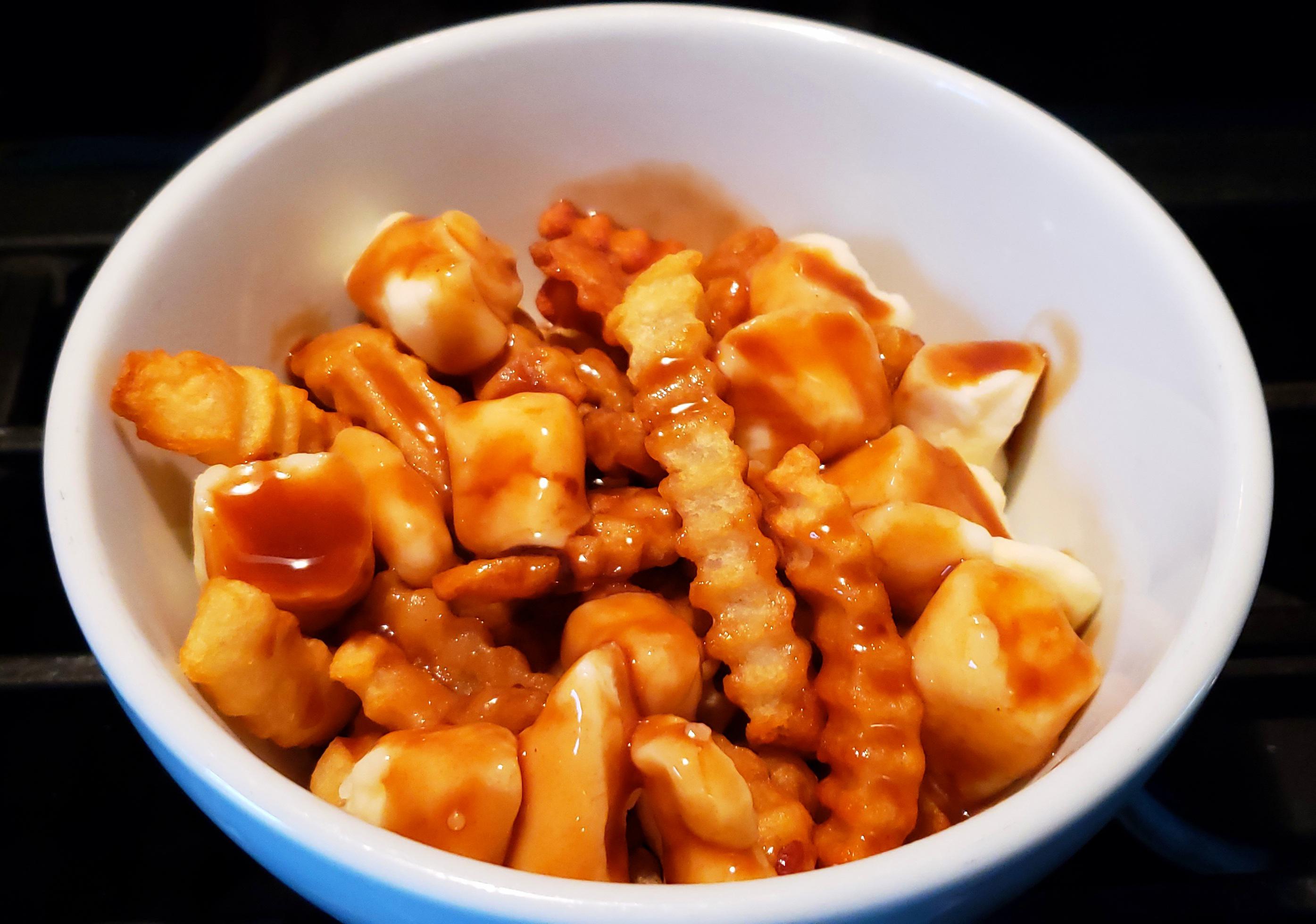 Homemade Poutine, Crinkle Cut Fresh White Cheddar Curds and Pan Gravy with Drippings | Scrolller