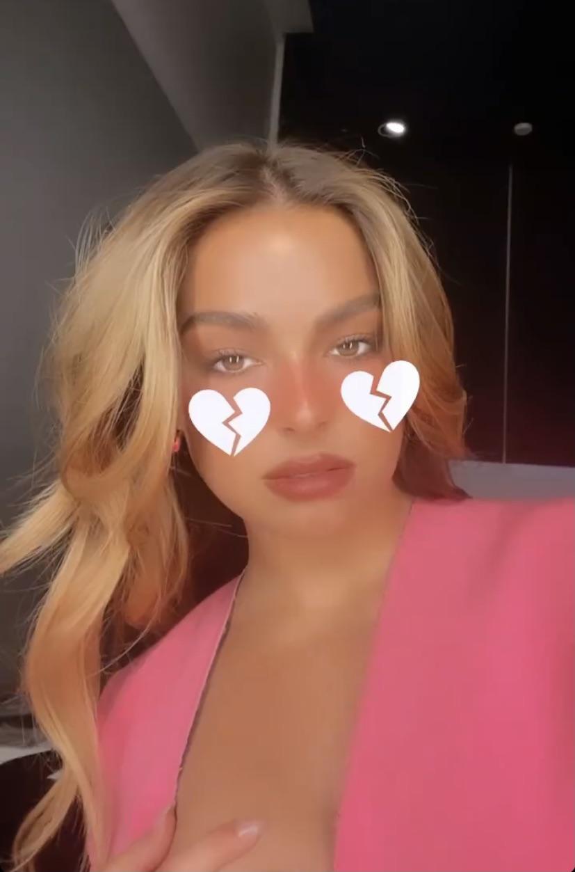 Is she touching her breast? | Scrolller