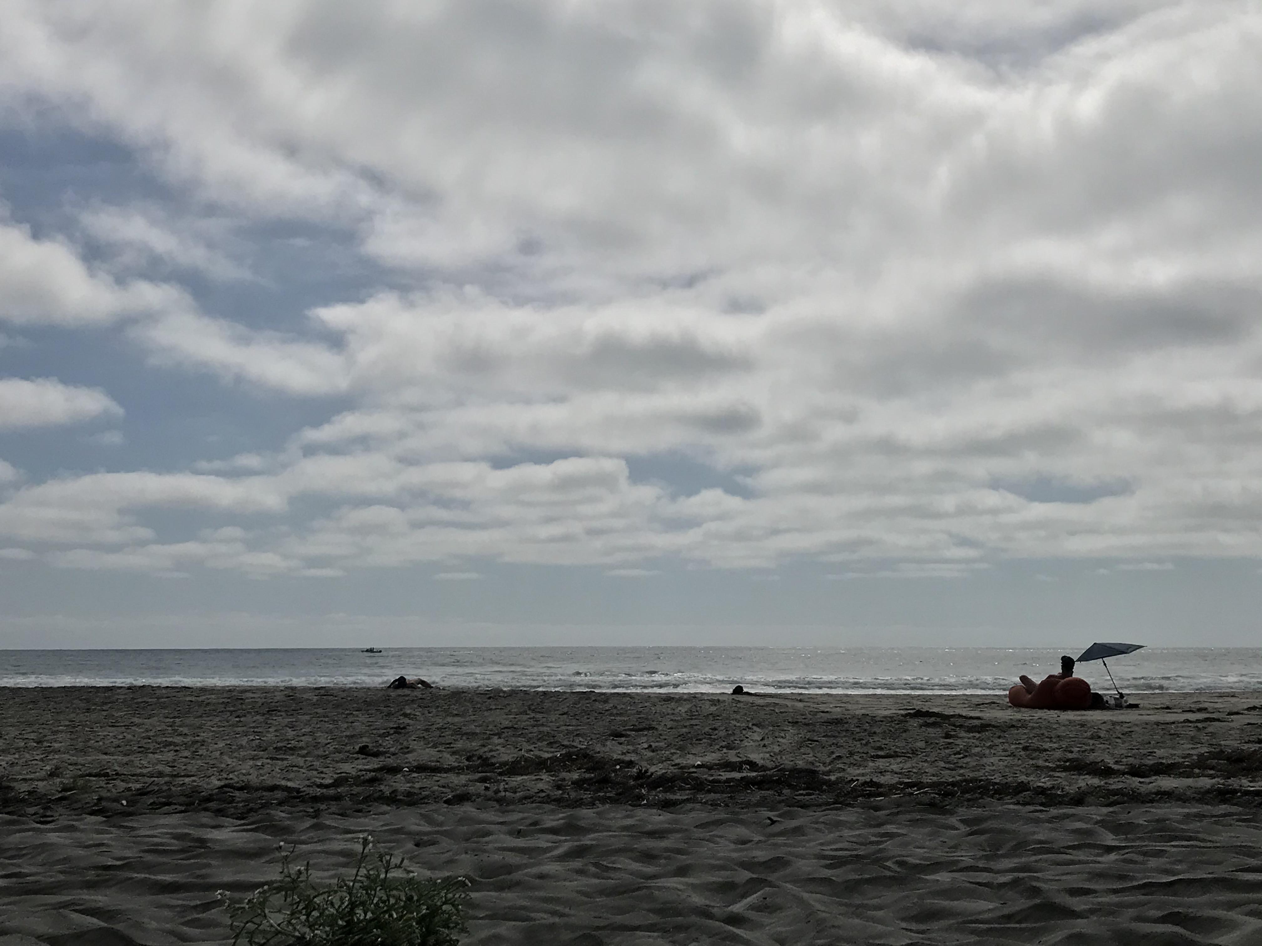 It was cloudy but warm. Noticing that it’s better to sit on the hot sand and then go in for a ...