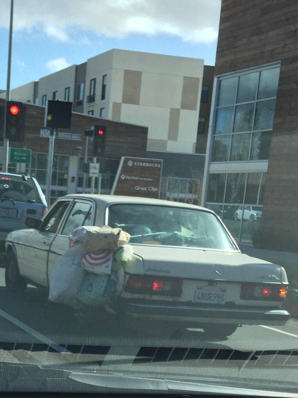 It was so full she had bags strapped to the trunk! | Scrolller