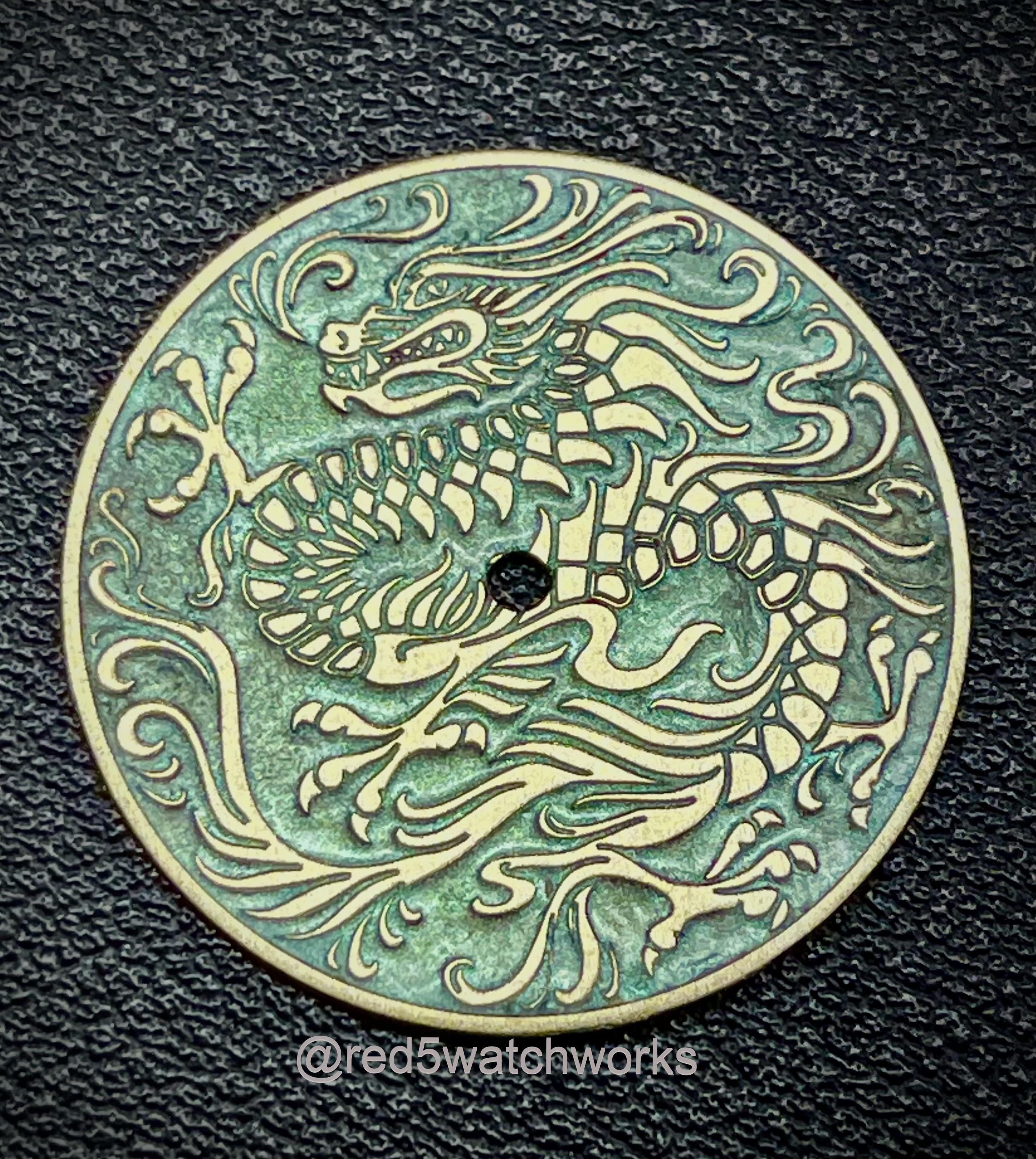 Jade dragon. Dial I cut from brass. | Scrolller