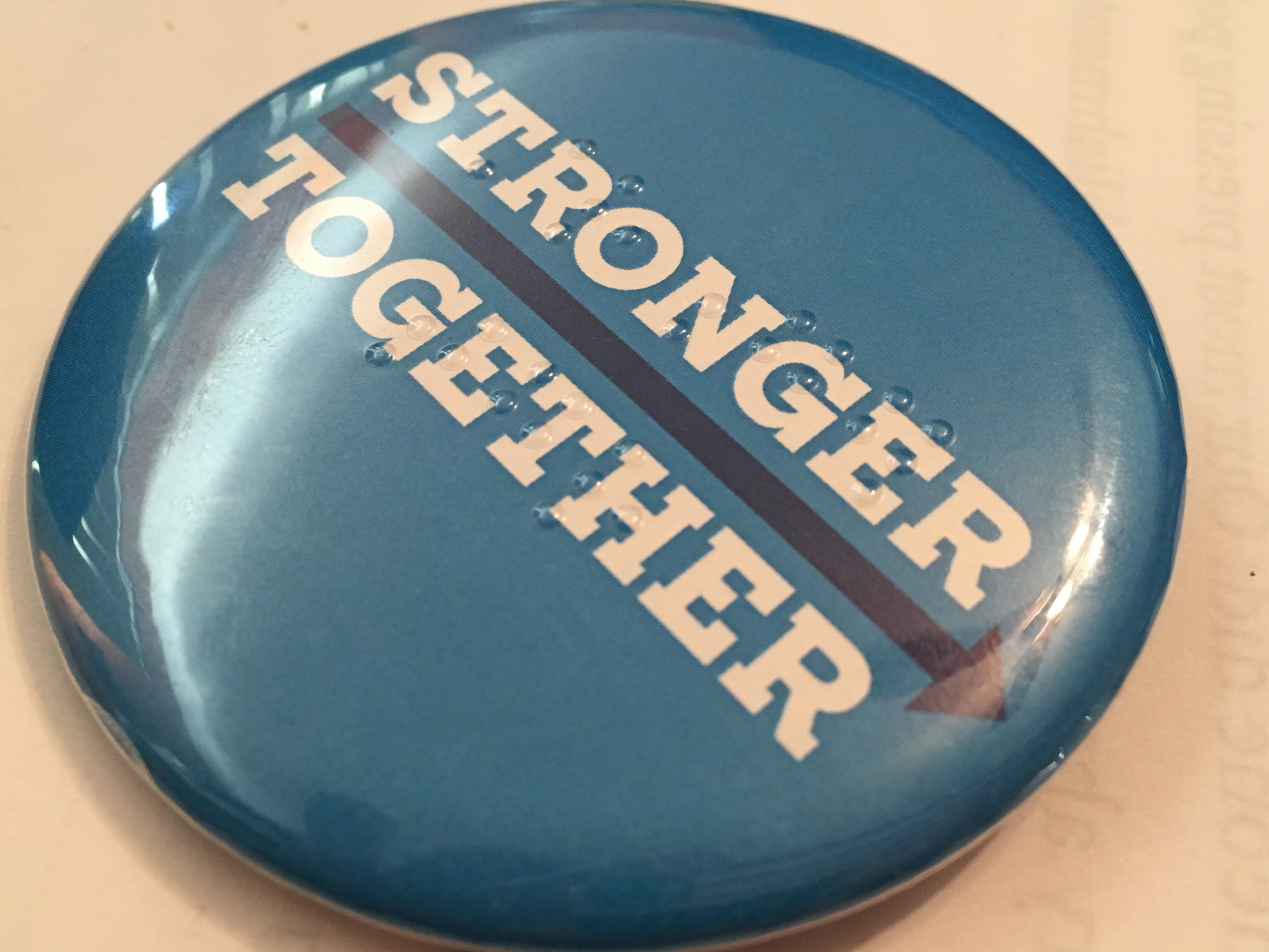 Just realized my "Stronger Together" pin has Braille on it. That's pretty cool! | Scrolller
