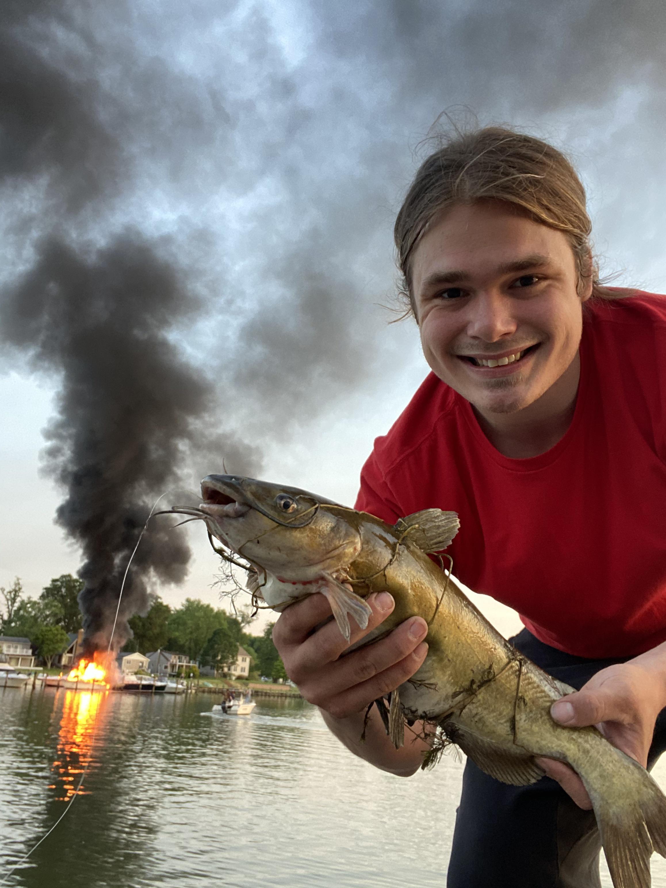 Literally hooked my first cat of the year as that boat exploded. | Scrolller