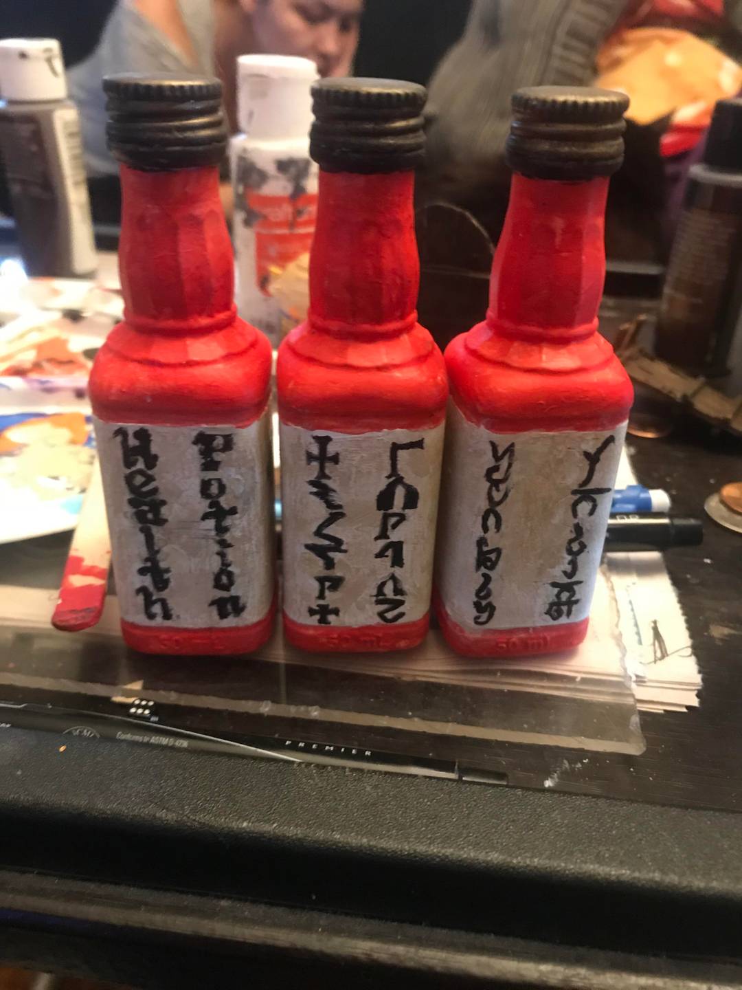 Made some health potions out of old jack daniels mini bottles. Holds tiny dice inside to roll ...