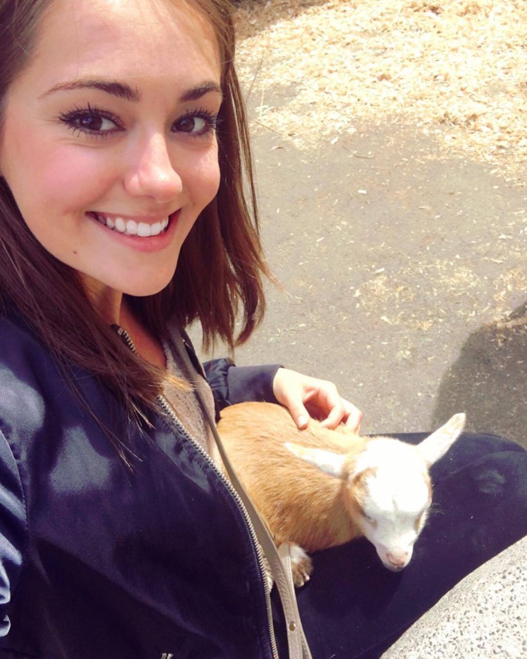 Matreya Fedor and a baby goat | Scrolller