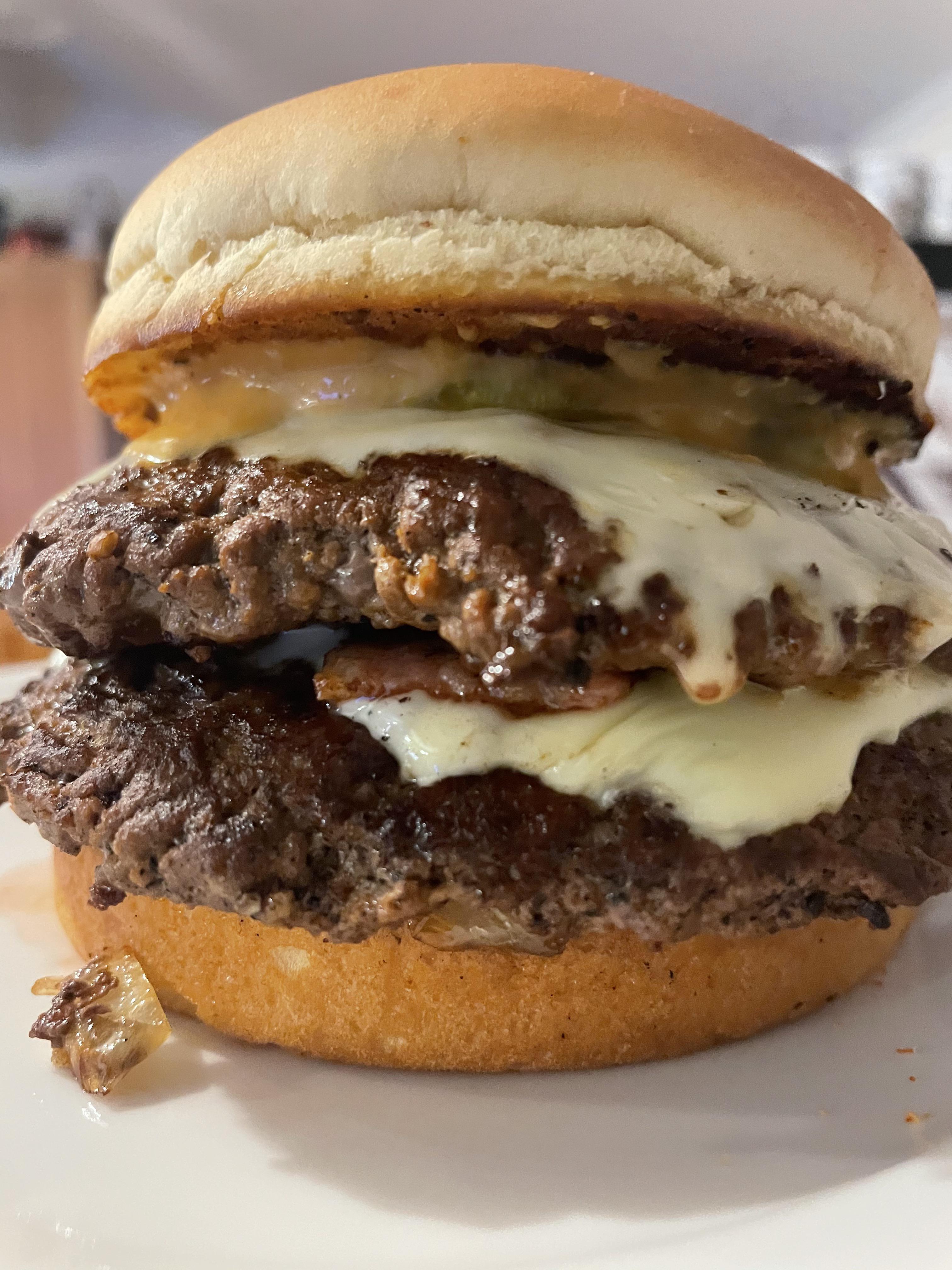 Messy AF to eat but delicious. Homemade burger with cheese, pickles, onions and burger sauce ...