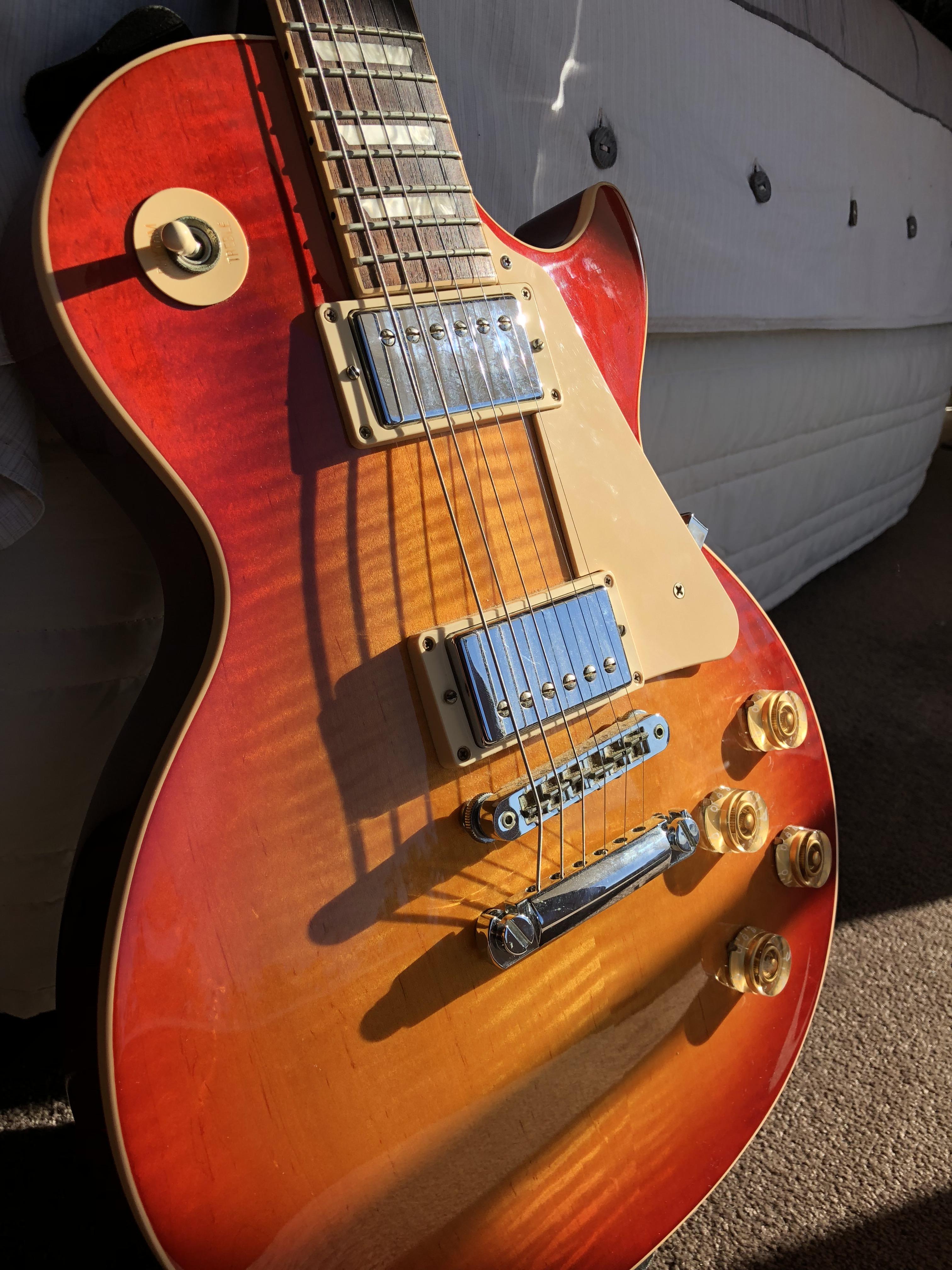 My 2014 Gibson Les Paul Traditional catching some afternoon rays | Scrolller