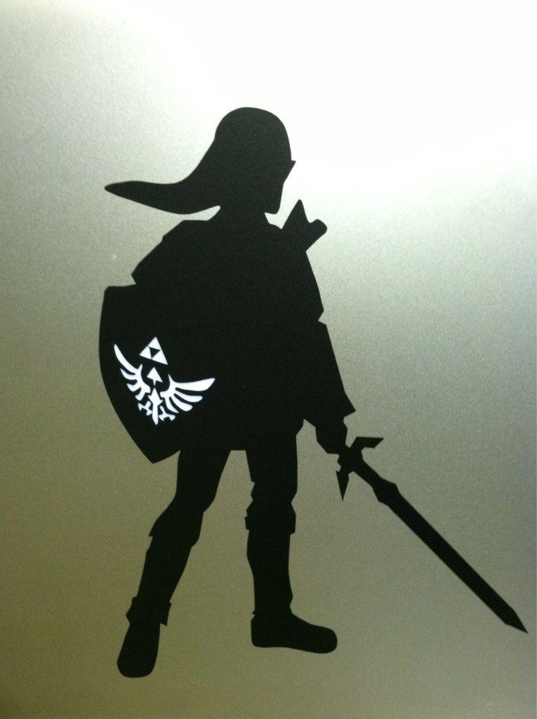 My bf's badass sticker for his Mac. Link's shield lights up when it's on:-) | Scrolller