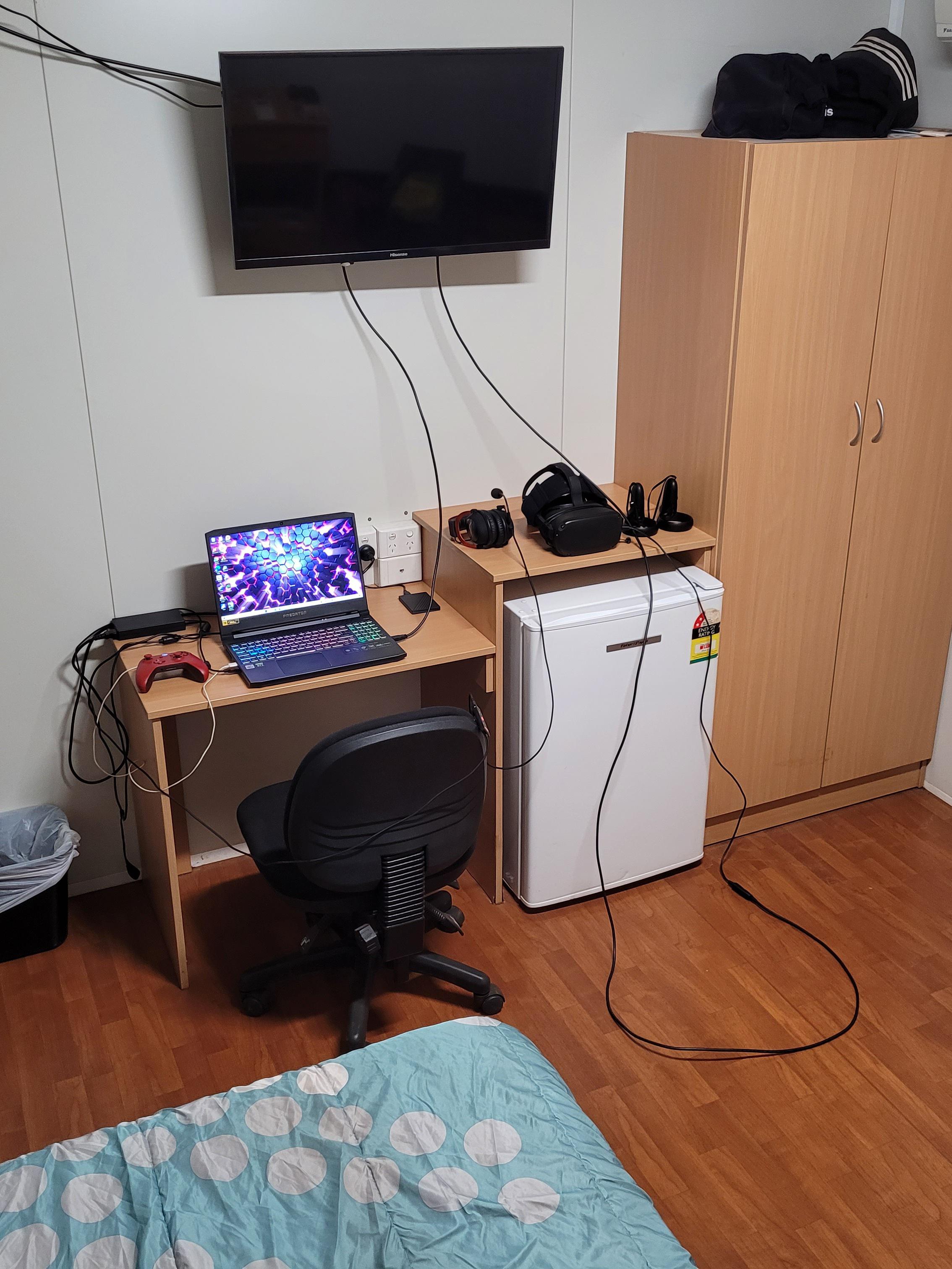 My fully portable gaming and VR battle station in one of the rooms I stay in up north for work ...