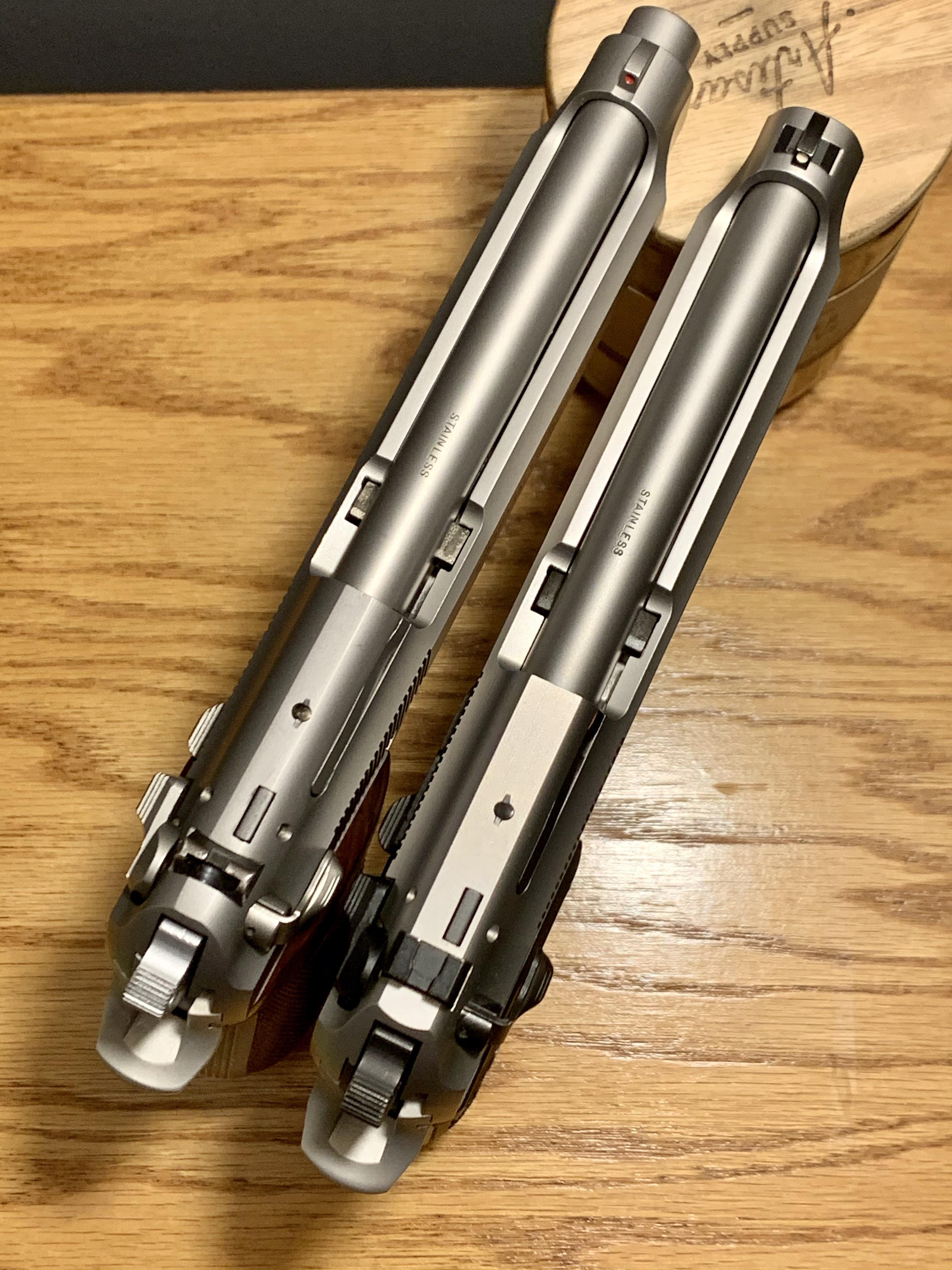 Pair of stainless beauties, Beretta 92FS INOX and Beretta 92FS INOX Vertec. | Scrolller