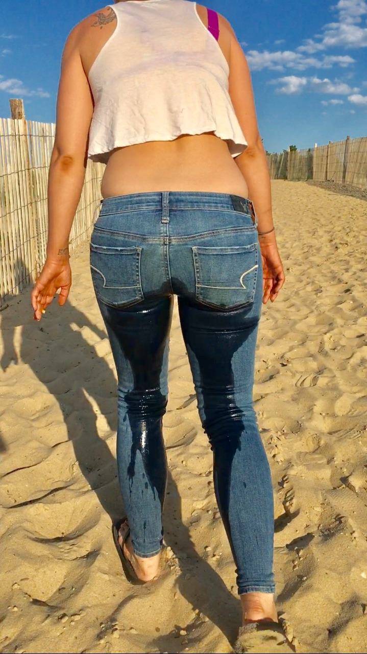 peeing her jeans while walking down the beach | Scrolller