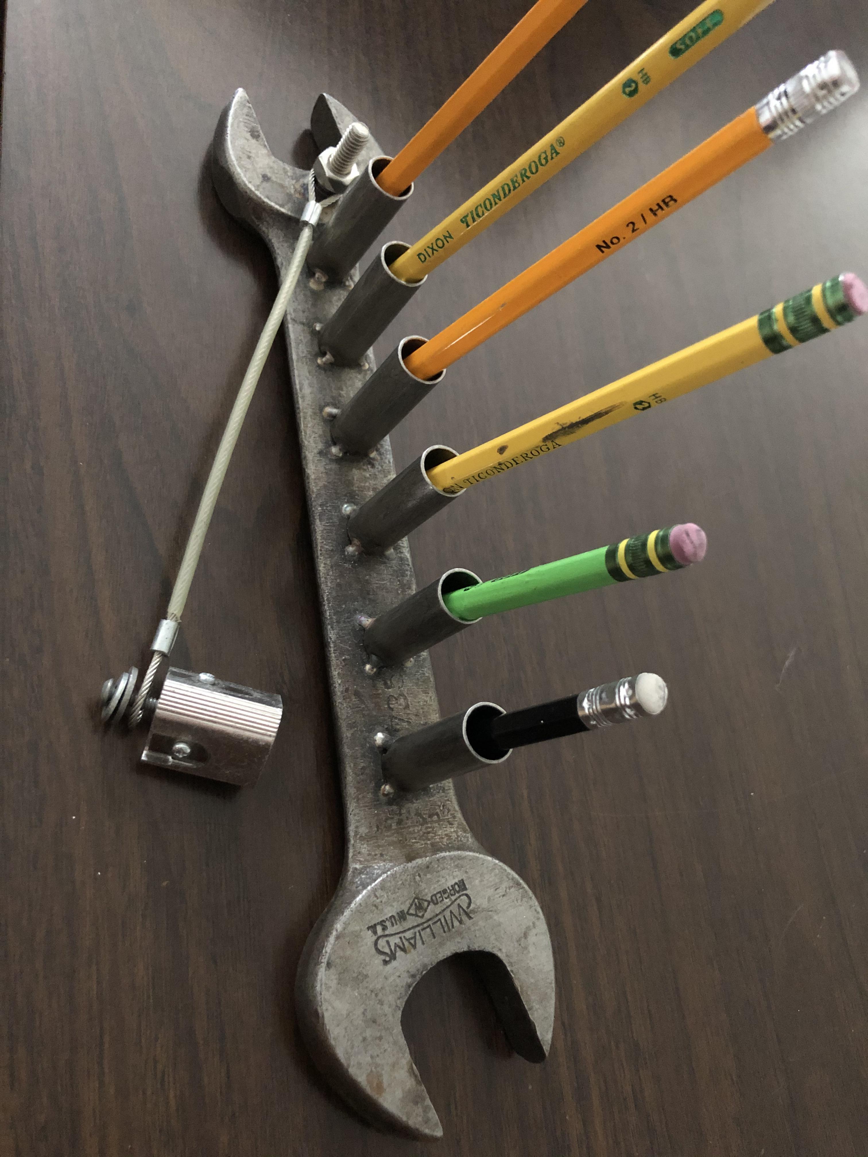 Pencil holder with sharpener. | Scrolller