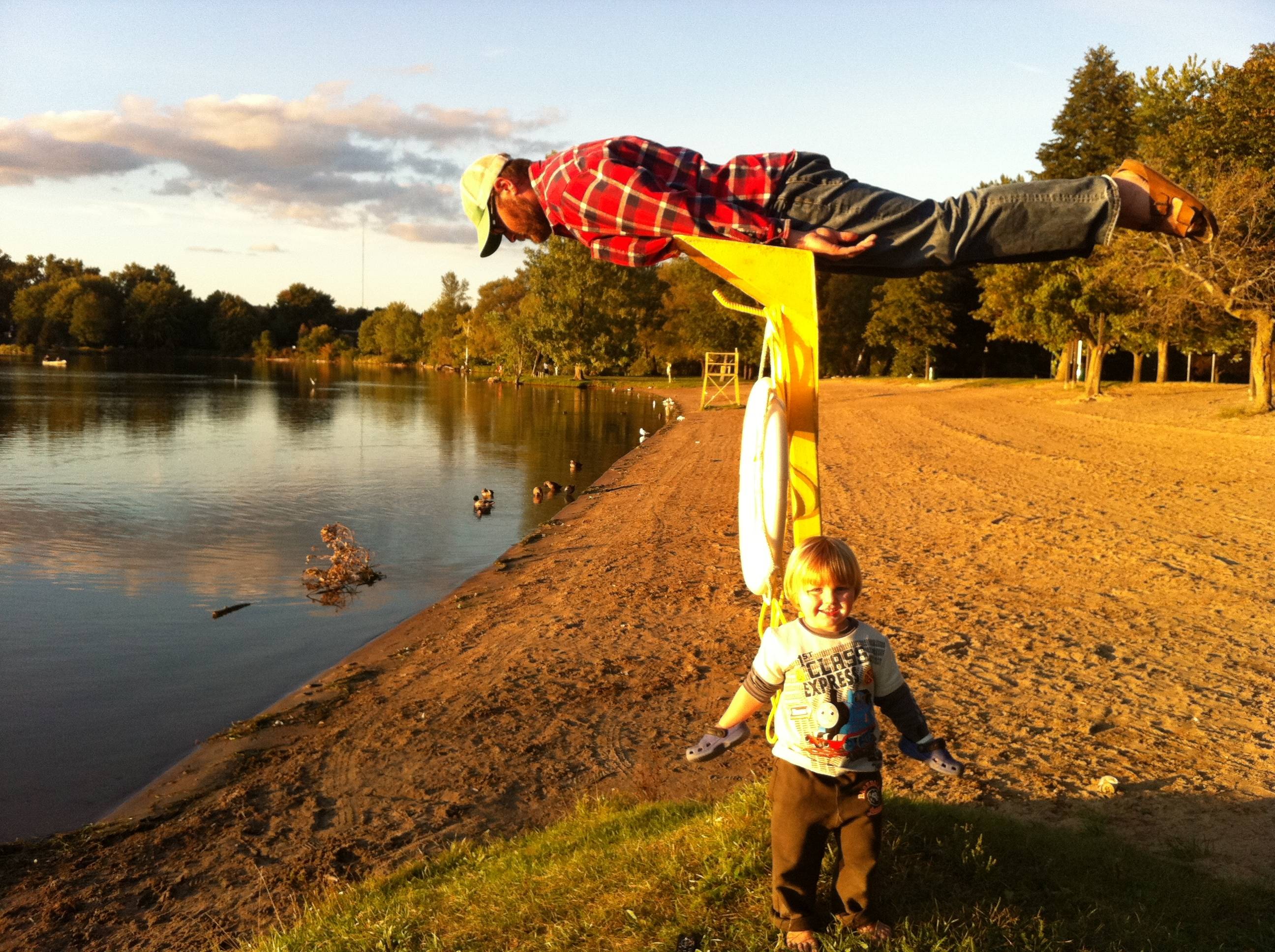Planking at the beach with my son in the foreground. | Scrolller
