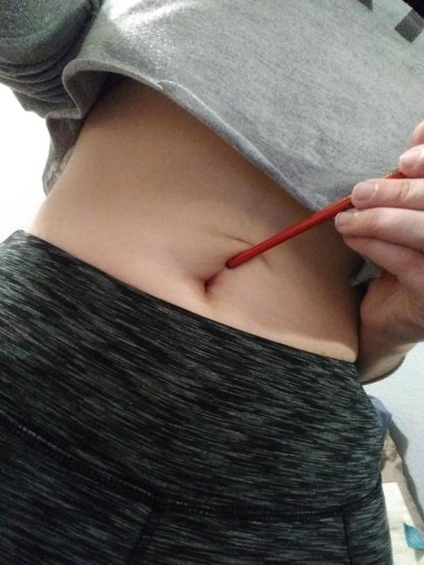 Poking her belly button | Scrolller