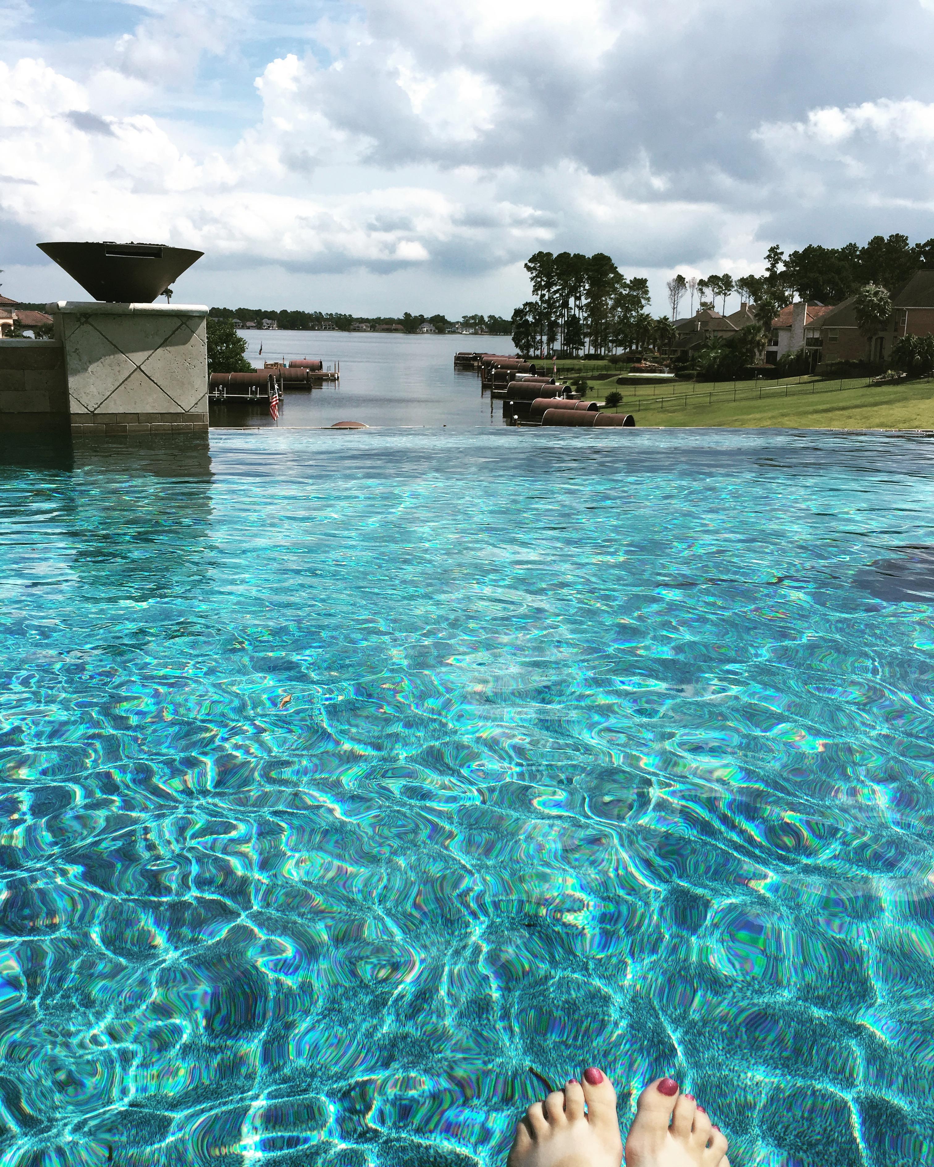 Prismatic pink toes in the new saltwater infinity pool. | Scrolller