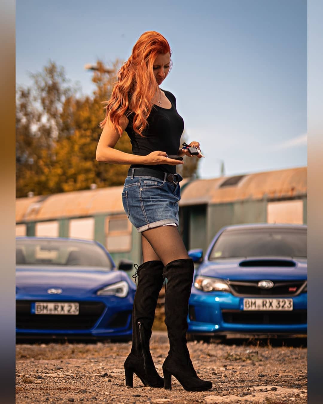 Redhead in denim and boots | Scrolller