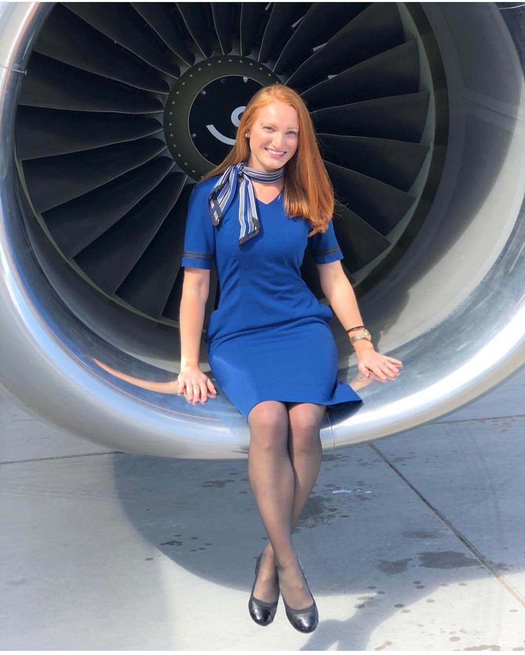 Sexy redhead flight attendant | Scrolller
