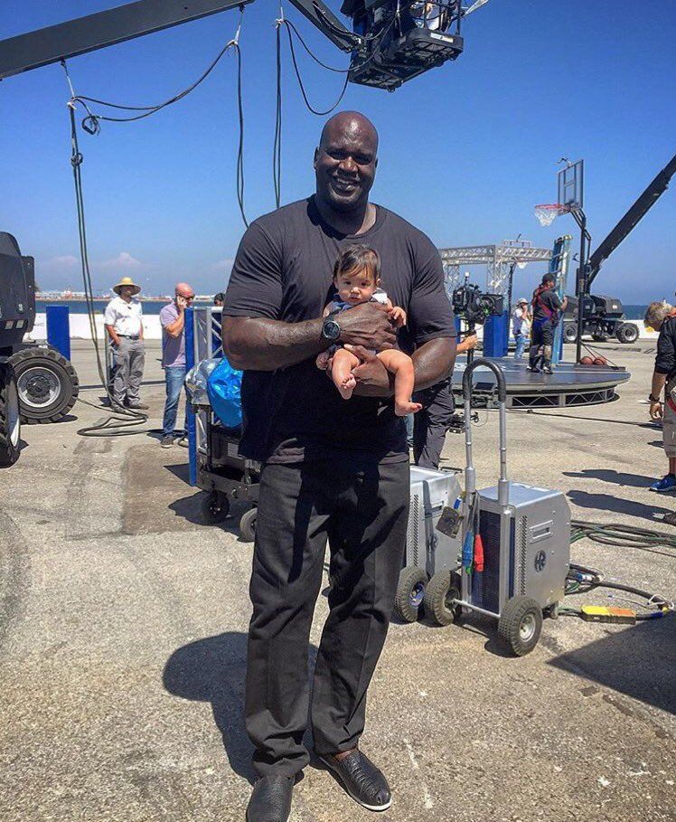 Shaq holding an adorable baby | Scrolller