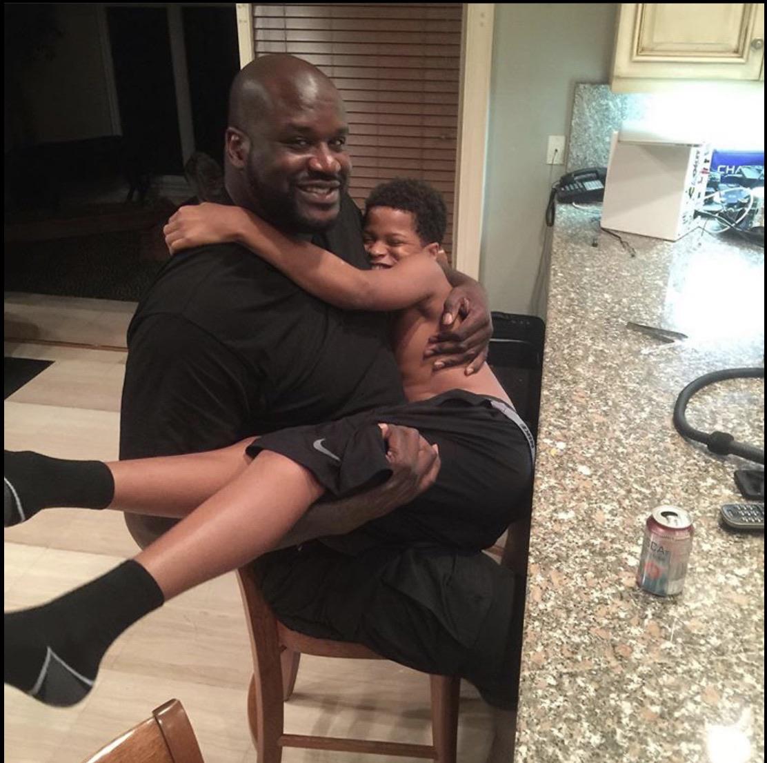 Shaq holding his son | Scrolller