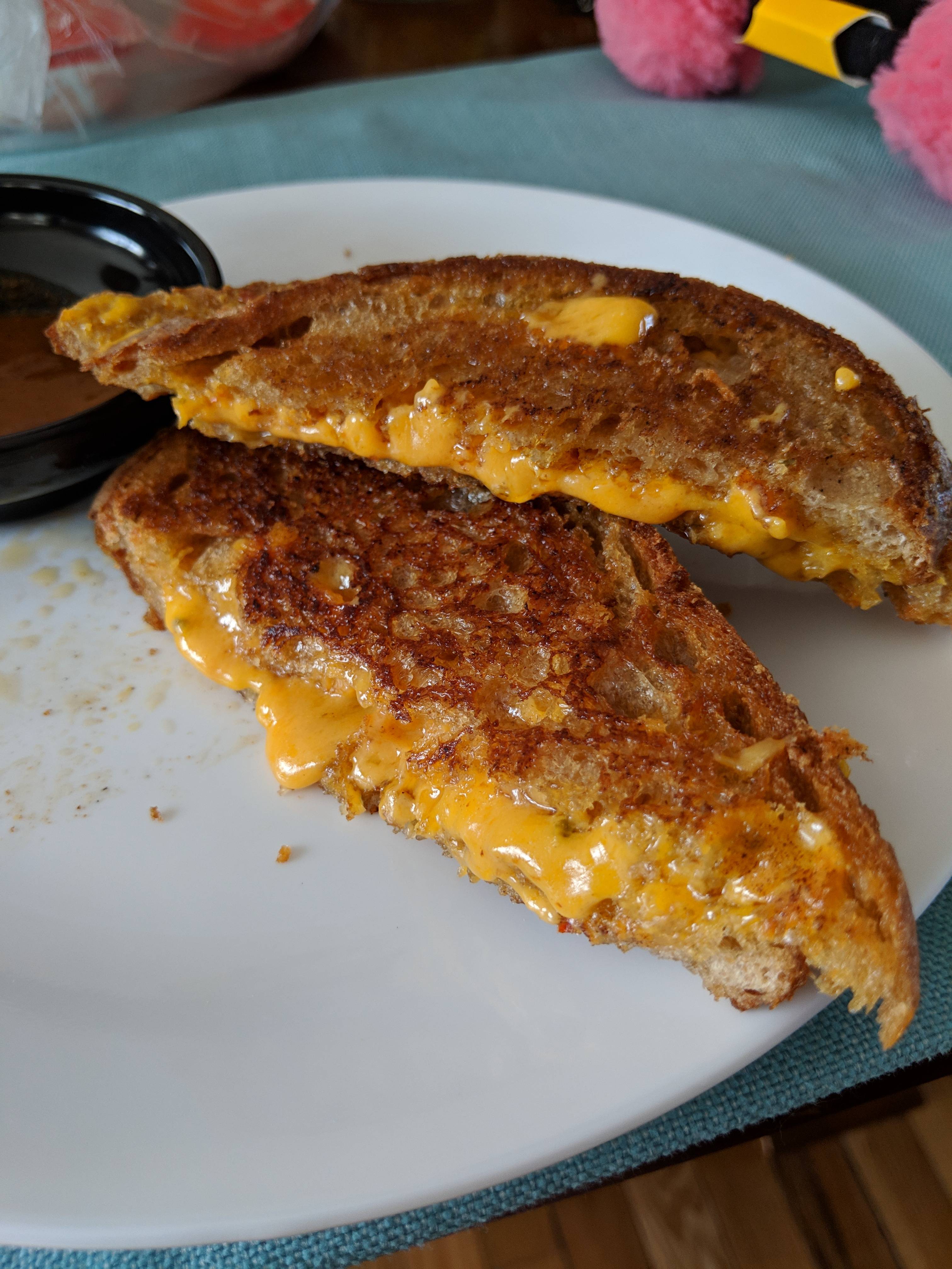Sharp cheddar and Yancey's Buffalo wing cheddar on sourdough | Scrolller