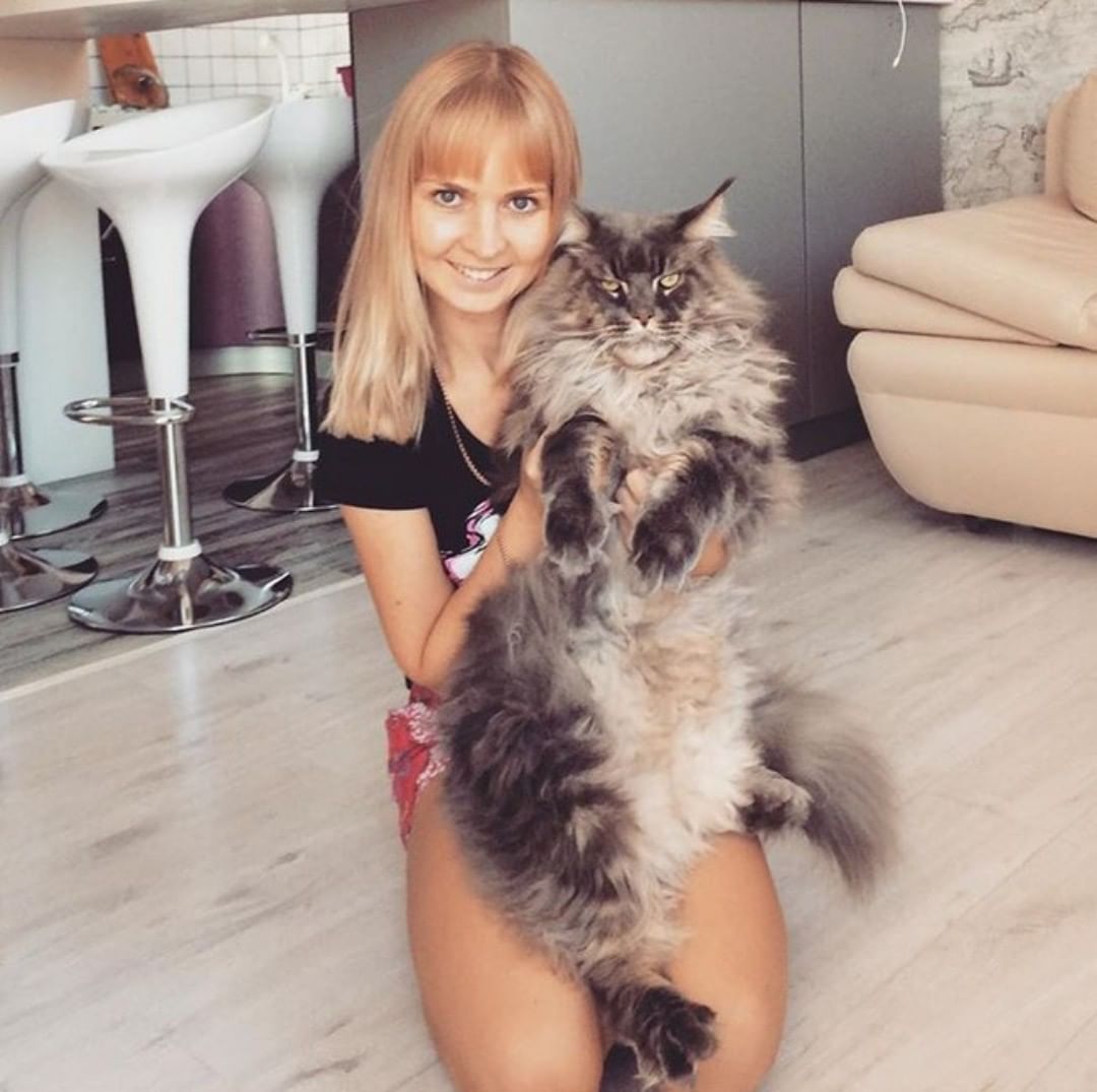 She kneels on the floor in front of you and gently displays her soft pussy for your enjoyment ...