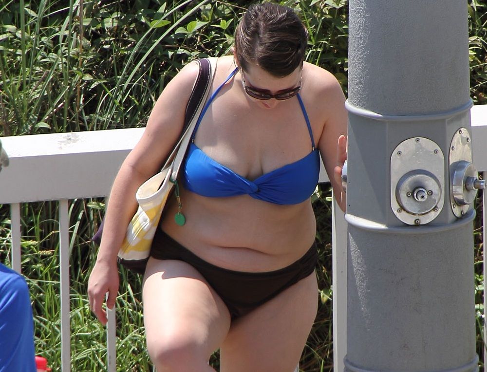 Soft belly on a beach MILF | Scrolller