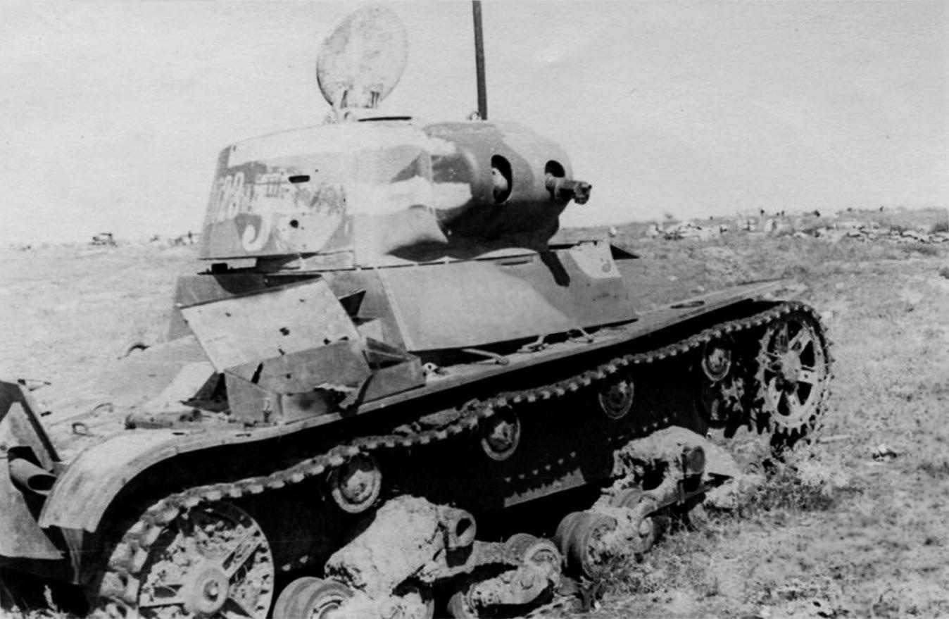 Soviet T-26 flamethrower version knocked out on a road during Operation Barbarossa. 1941 ...