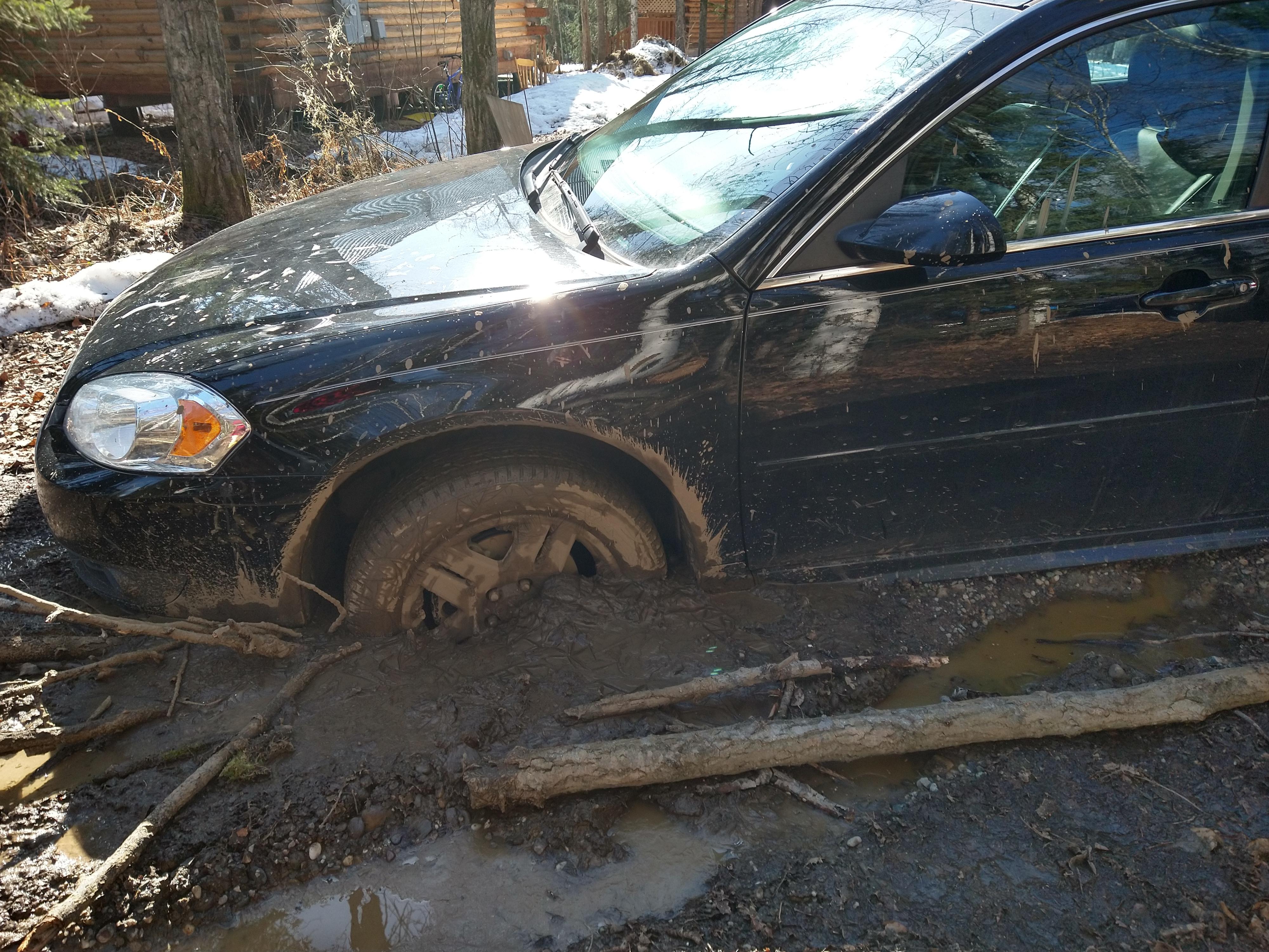 Spring breakup is the worst: stuck in the driveway. | Scrolller