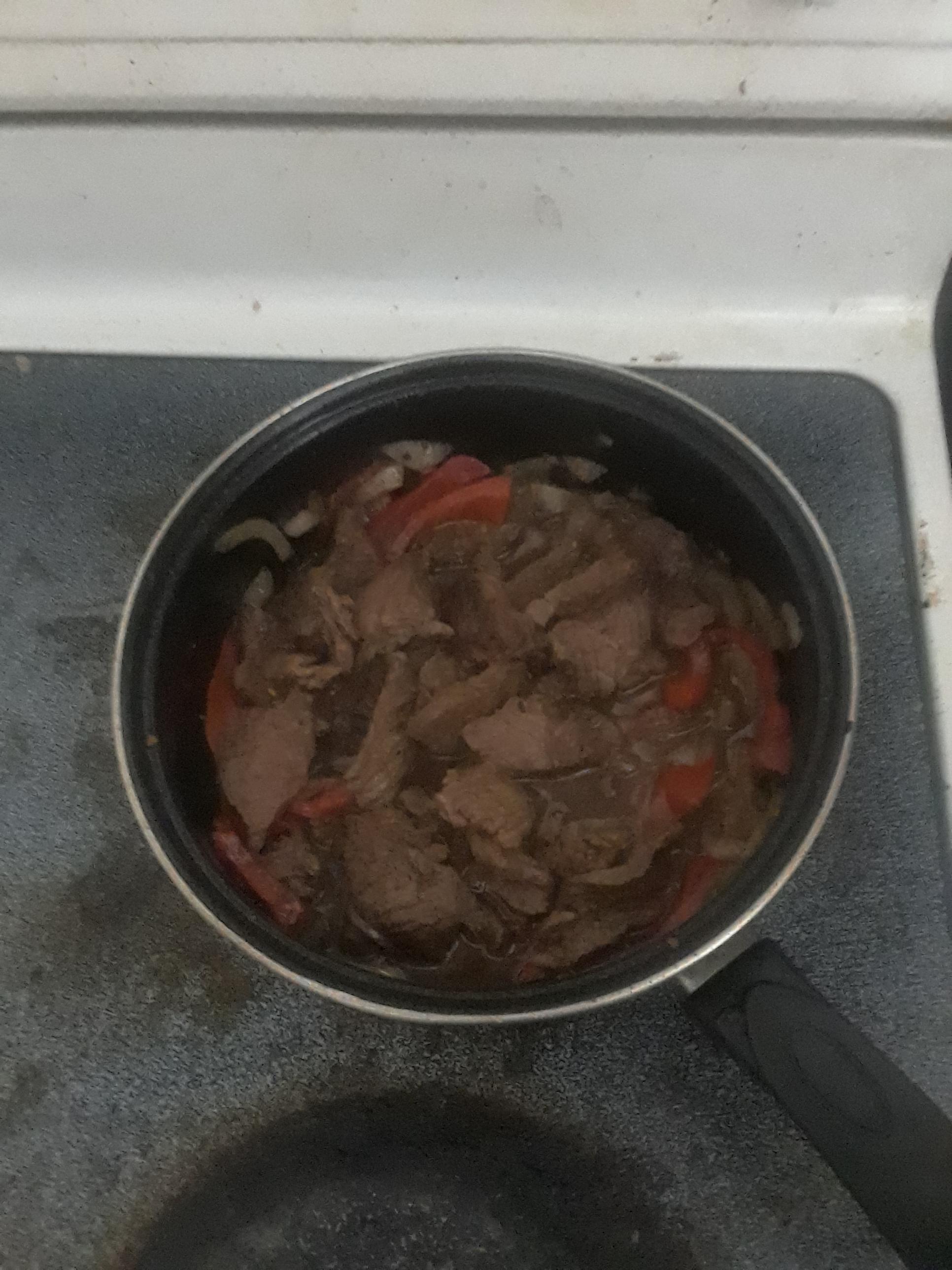 Steak, onion and red bell pepper. | Scrolller