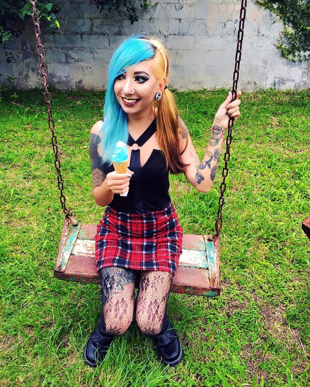 Swinging With Her Ice Cream | Scrolller